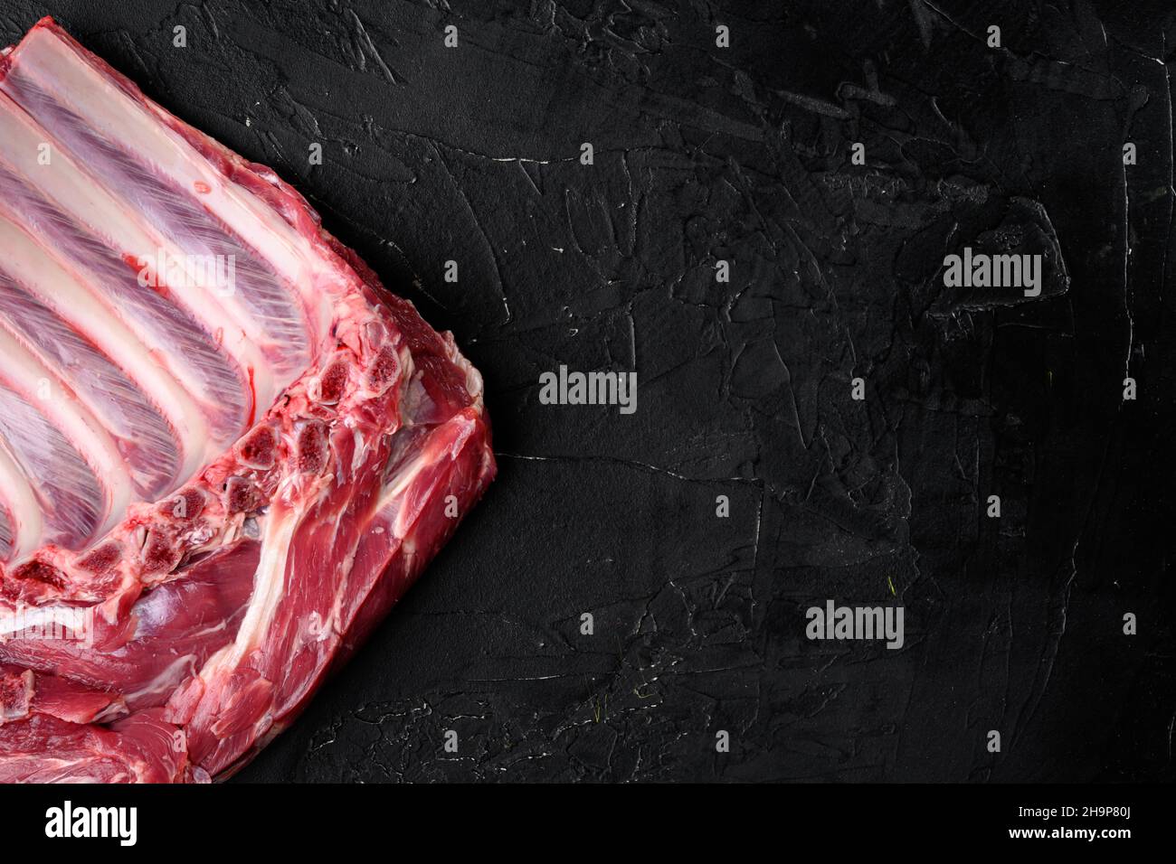 Organic lamb meat sheep or Mutton set, on black dark stone table ...