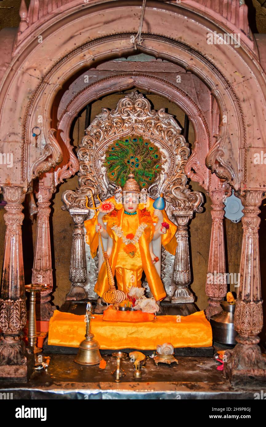 Hindu God Dattatrya in decorative wooden frame Devhara Stock Photo - Alamy