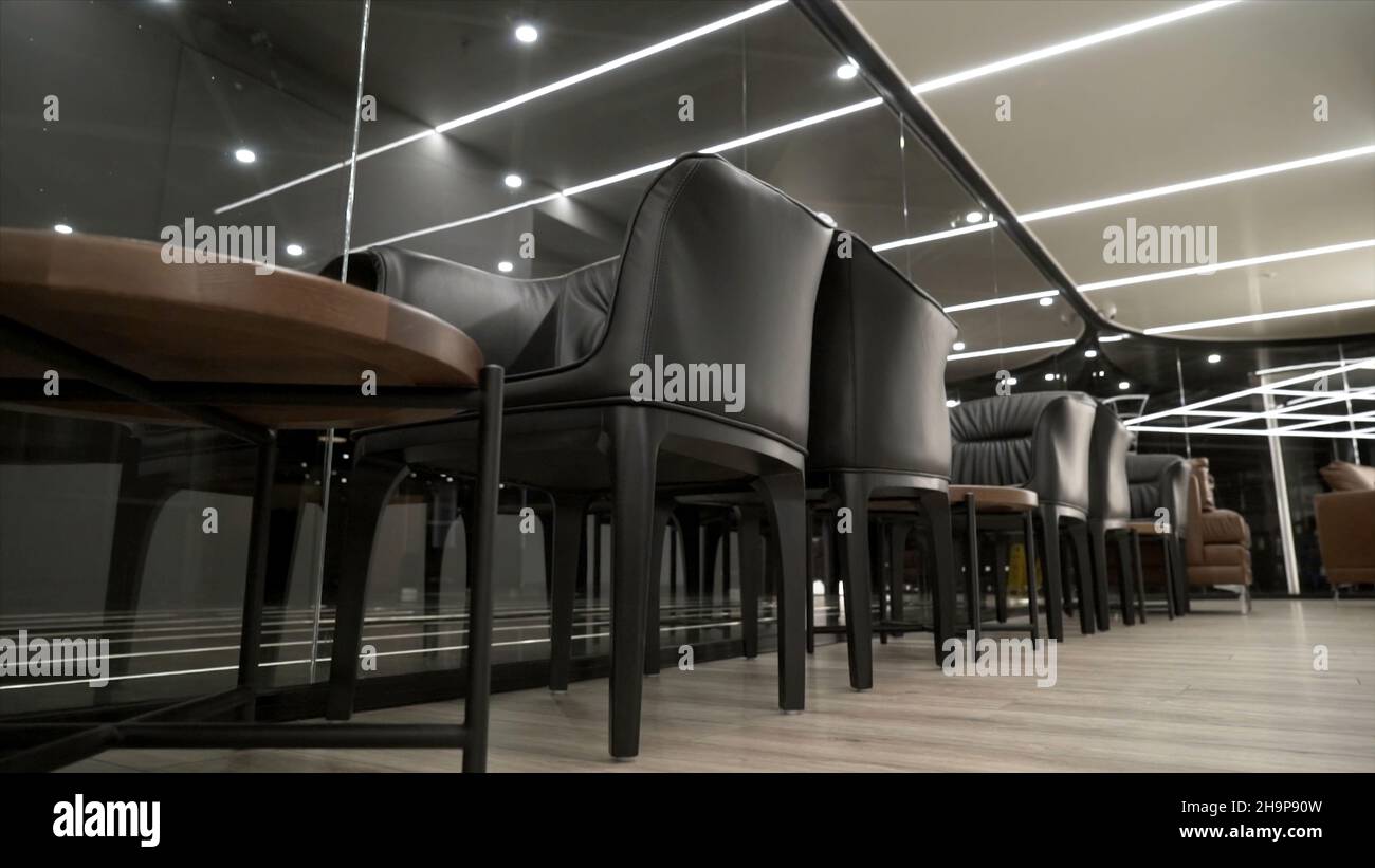 Business chairs and tables for two in luxurious restaurant. Action ...