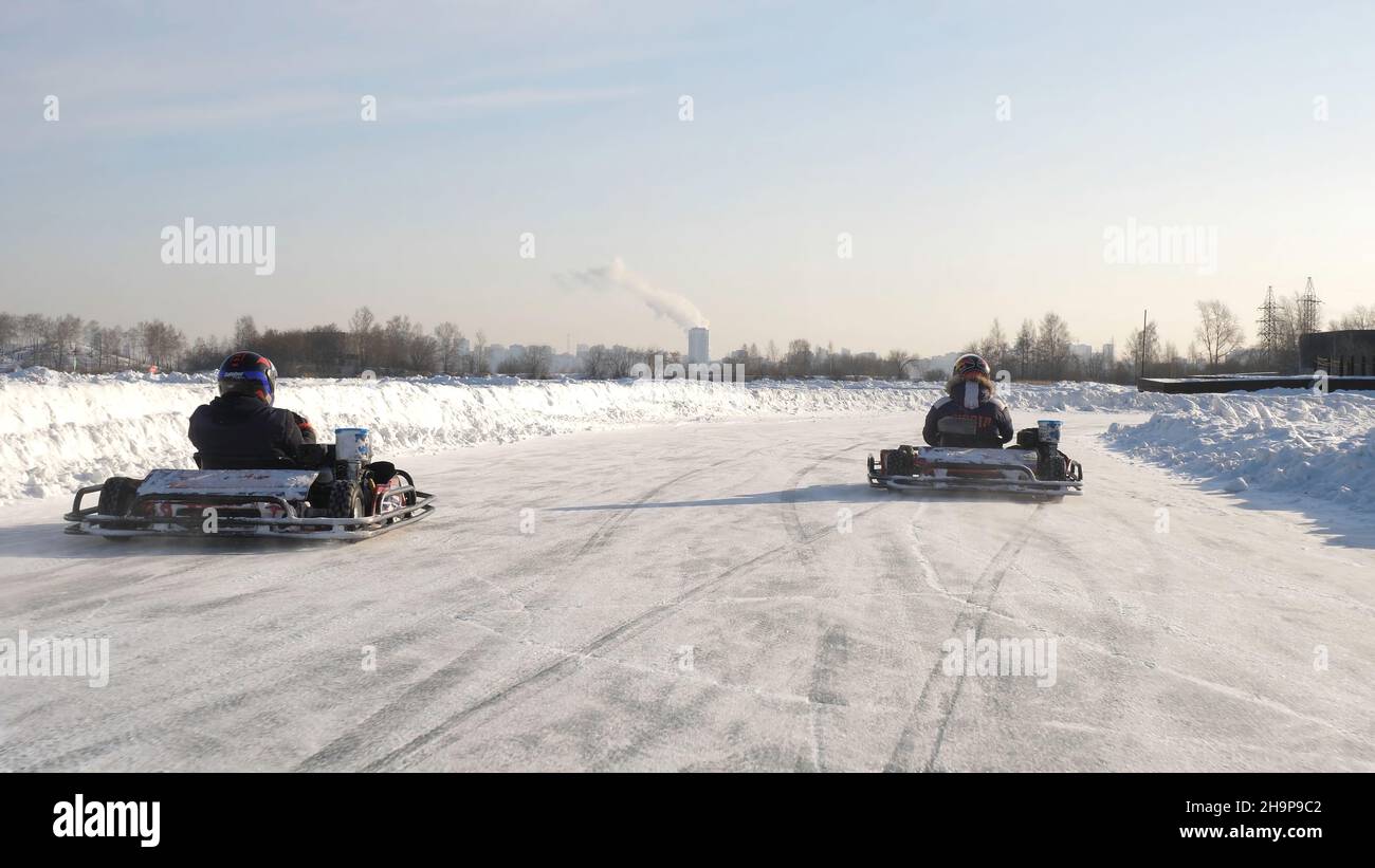 Winter competitions of kart racing on the ice of road. Go kart in ...