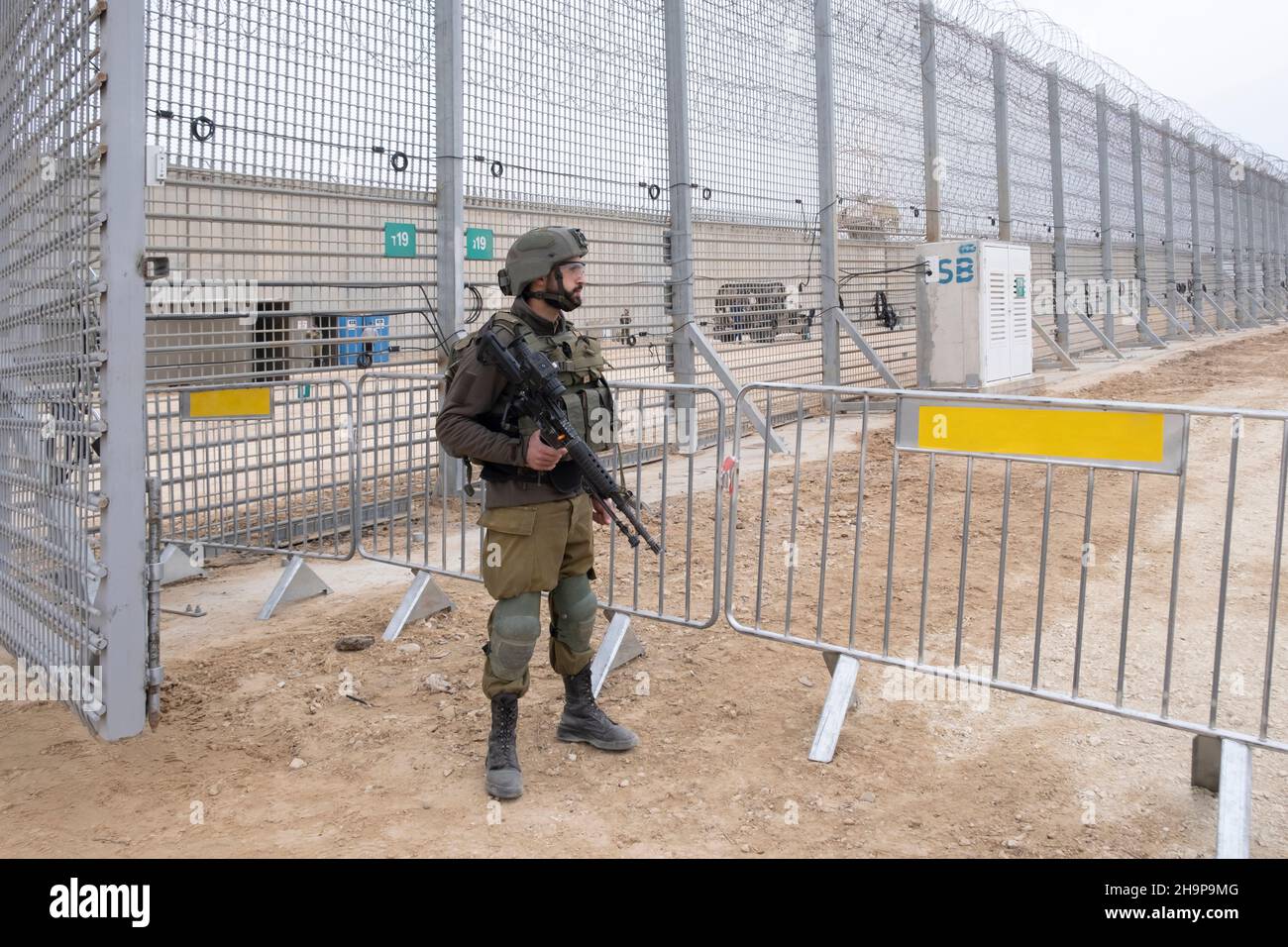 Gaza Border, Israel. 7th Dec, 2021. An Israeli soldier stands guard ...