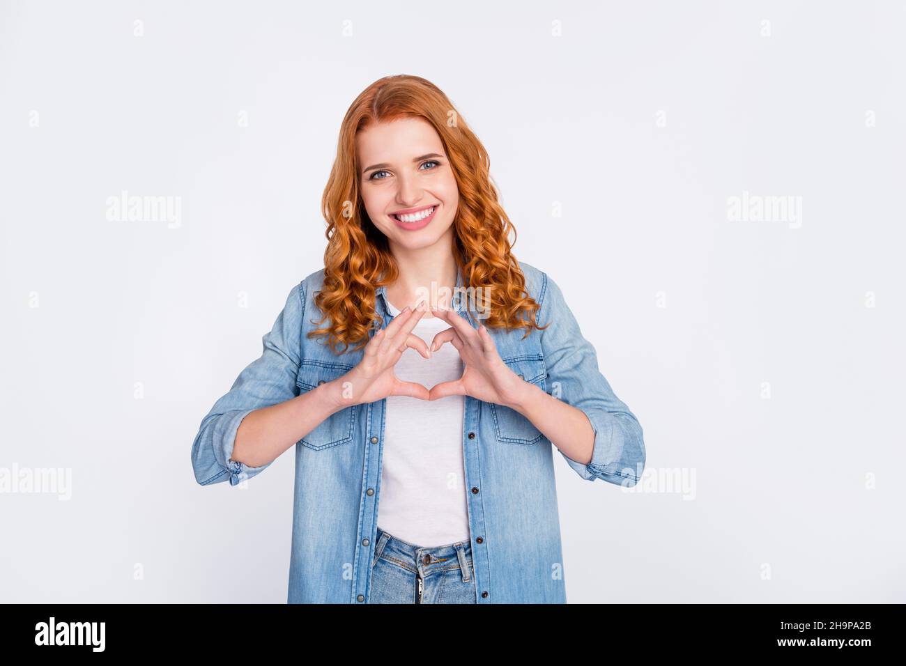 Photo of young attractive girl happy positive smile show fingers heart ...