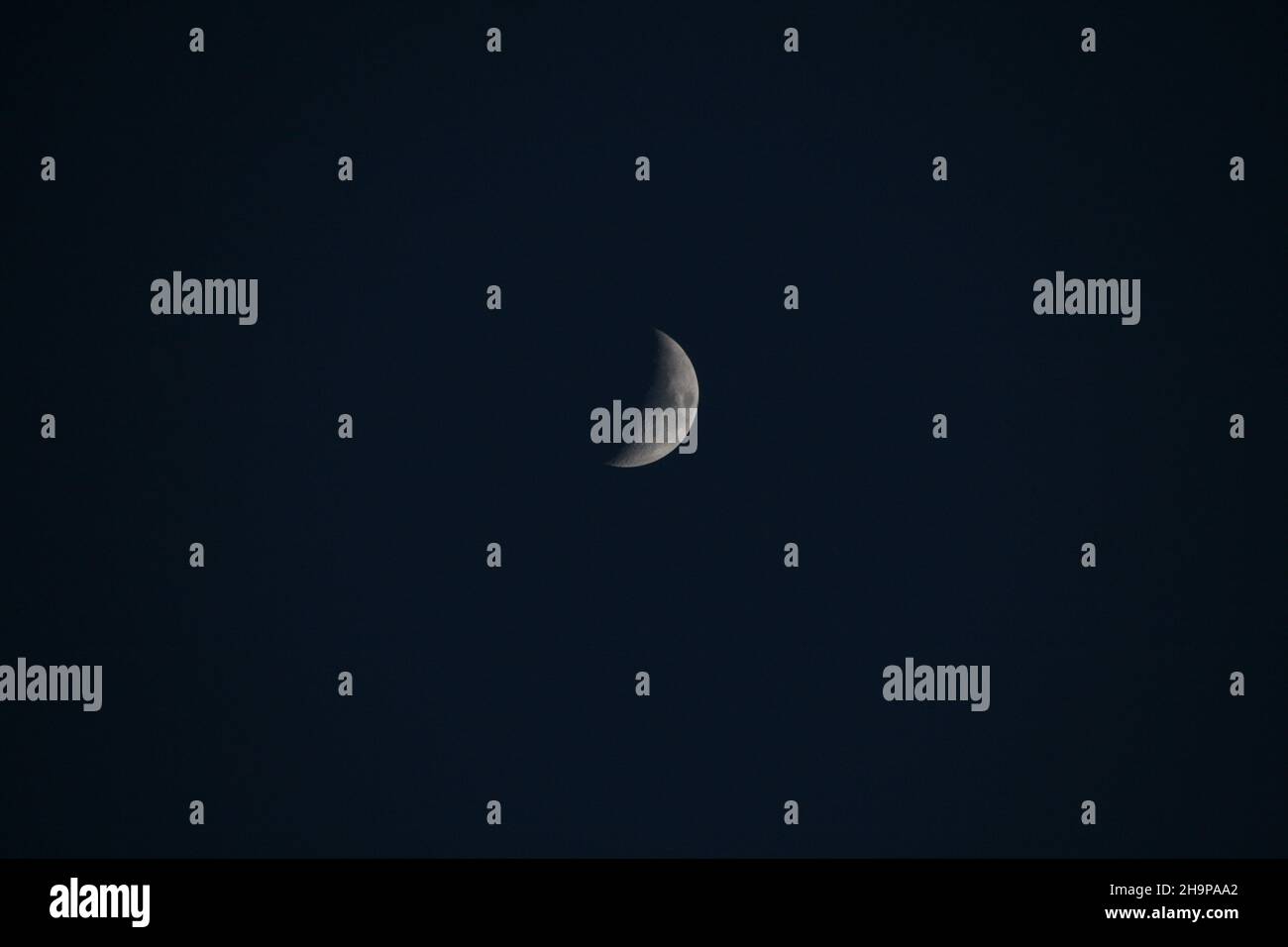 Beautiful night view of the half-moon in the sky Stock Photo - Alamy