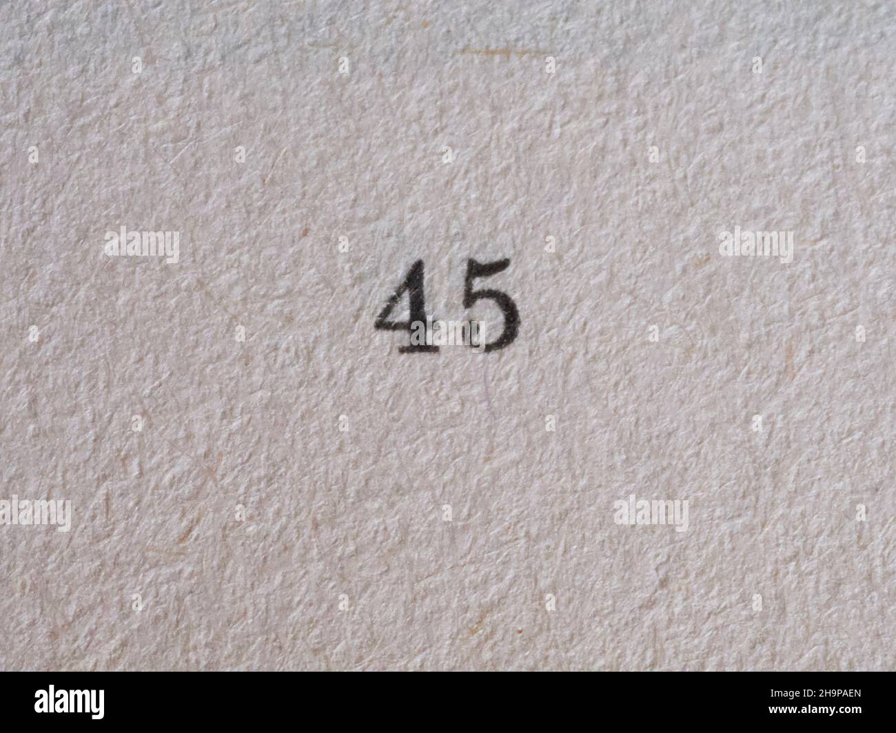 The number 45 printed on a piece of paper. Paper texture Stock Photo ...