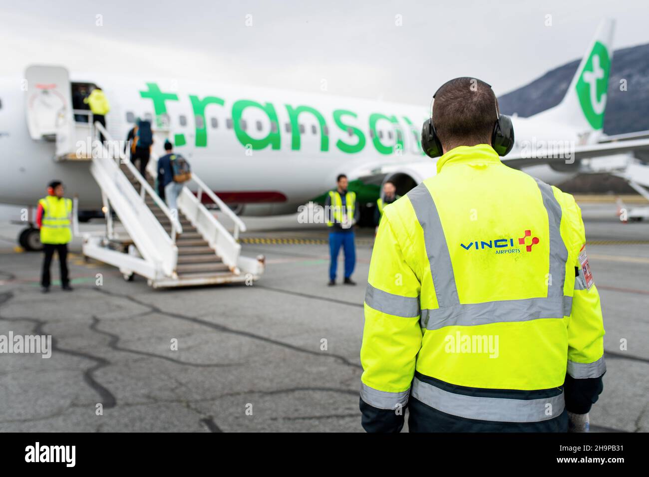 Vinci Airports ground staff on the tarmac during the boarding of a ...
