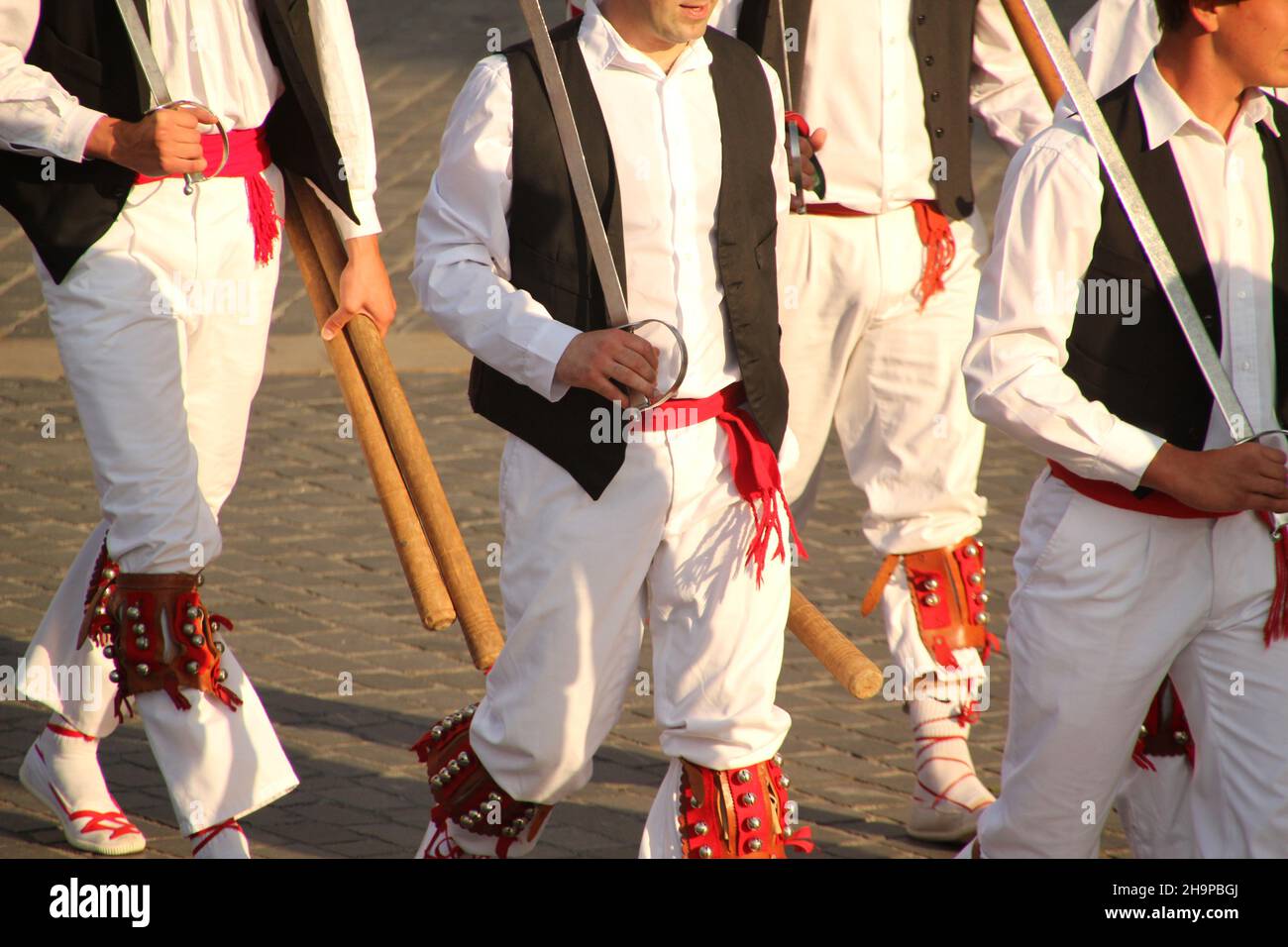View of people with traditional clothes dancing a folk dance in Basque ...