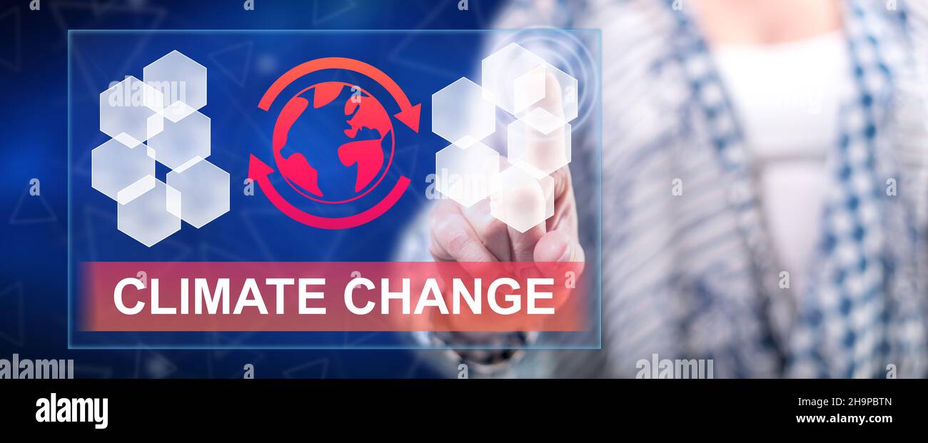 Woman touching a climate change concept on a touch screen with her ...