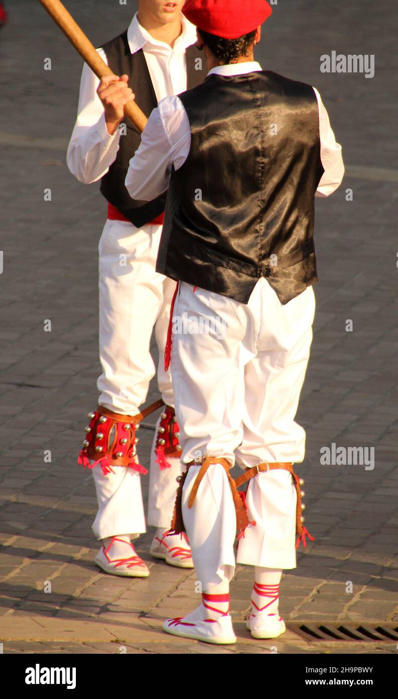 View of people with traditional clothes dancing a folk dance in Basque ...
