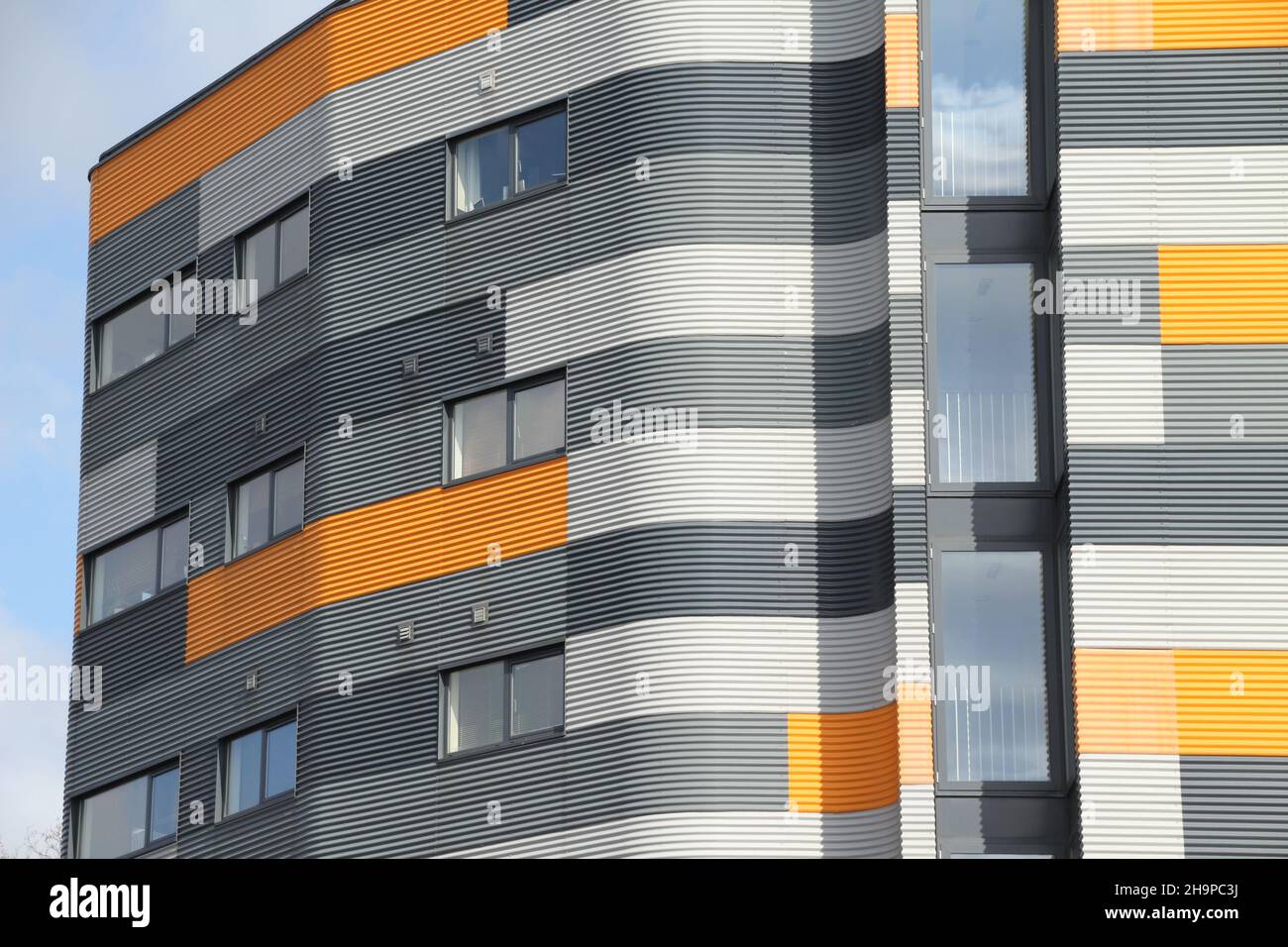 Modern building with gray and yellow exterior walls in London Stock ...