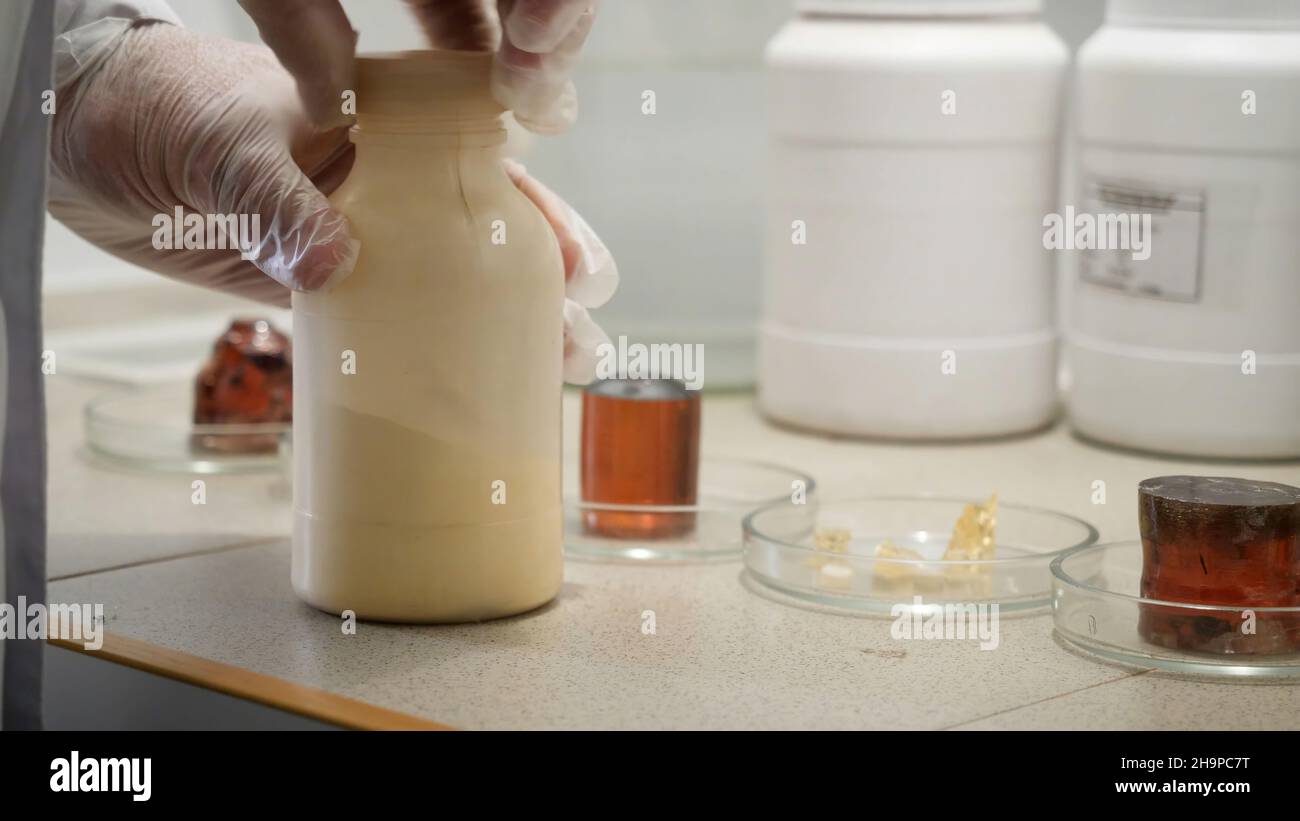 Researcher prepares to conduct chemical experiment in laboratory ...