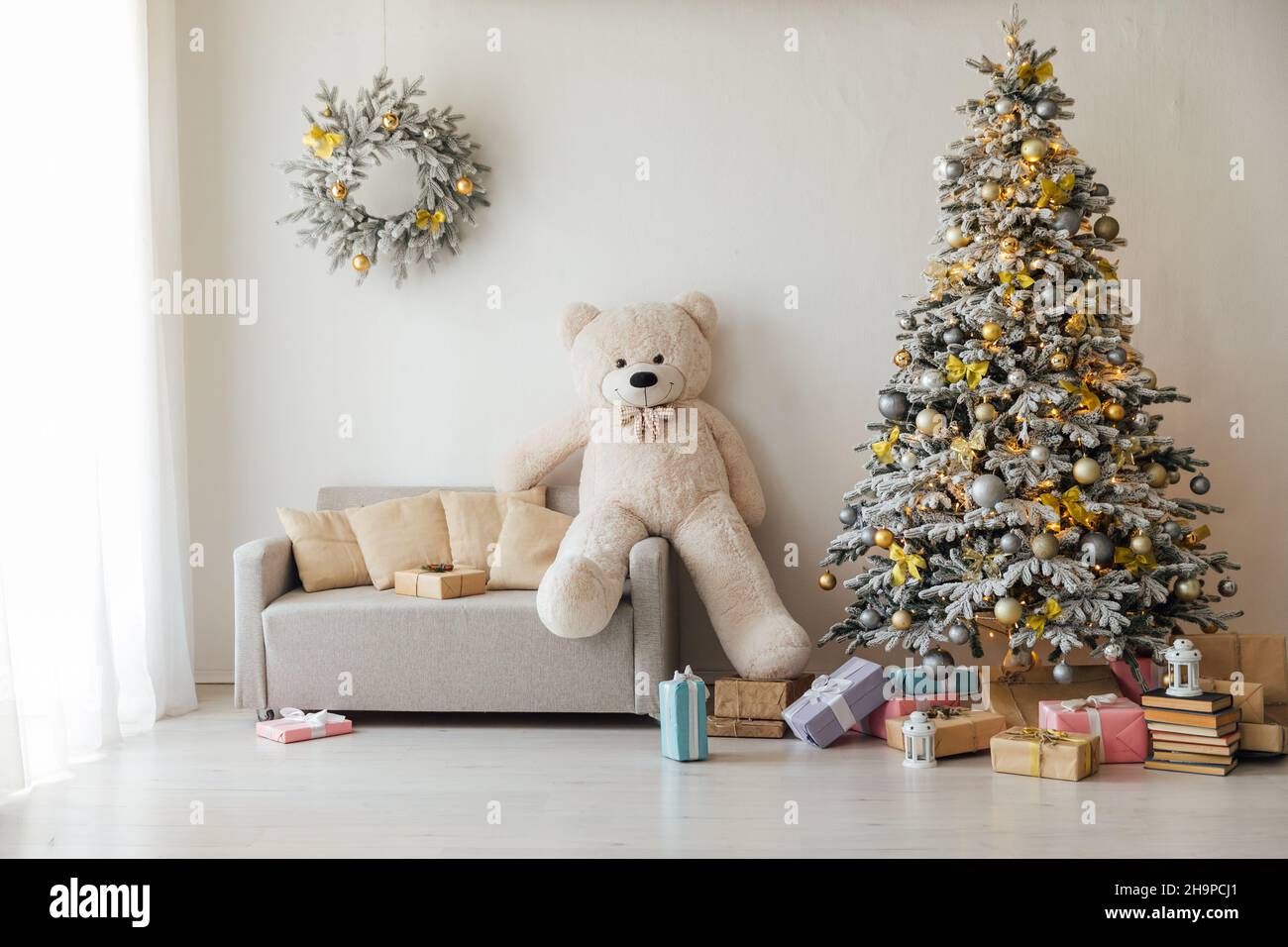 white snow-covered Christmas tree with gifts decorations new year Stock ...