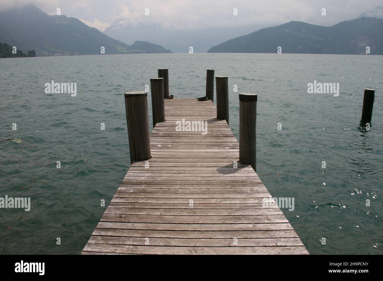 Wooden port leading into the sea in Switzerland Stock Photo - Alamy