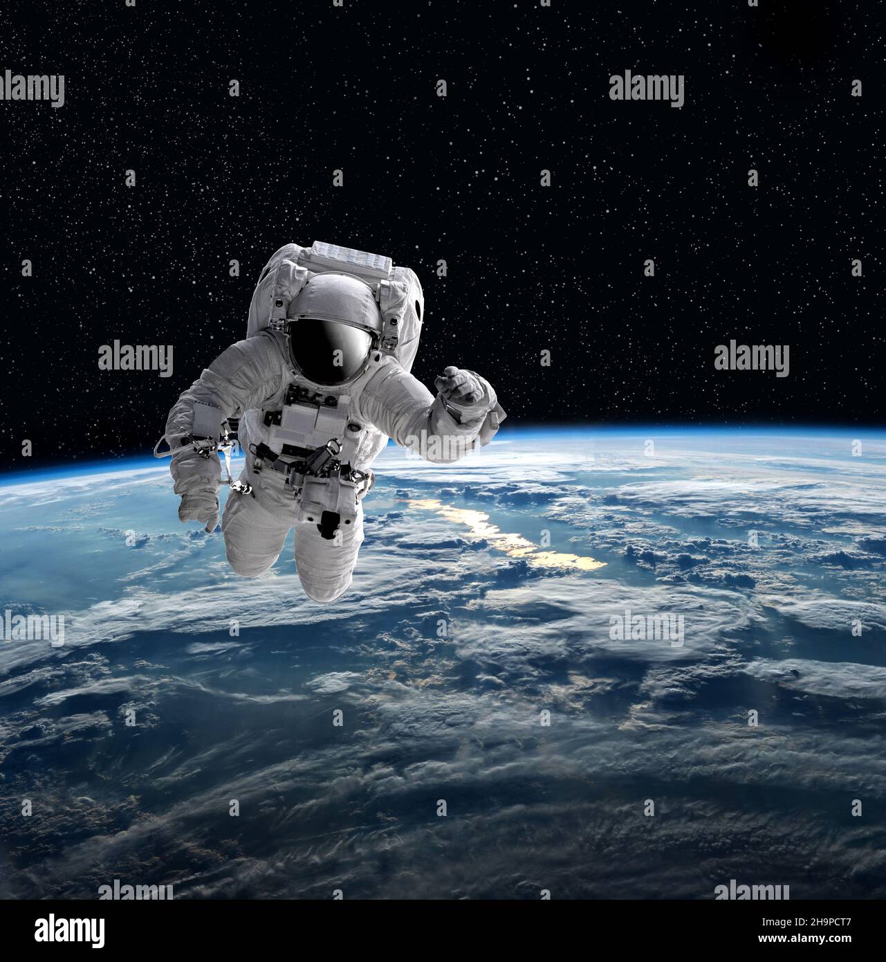 Astronaut floating above earth hi-res stock photography and images - Alamy