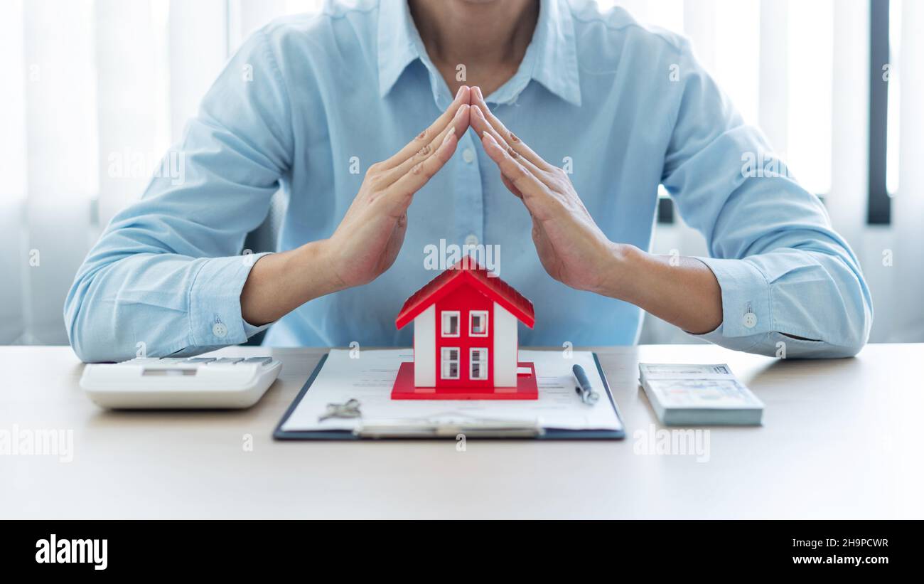 The real estate concept the realtor presenting his work towards his ...