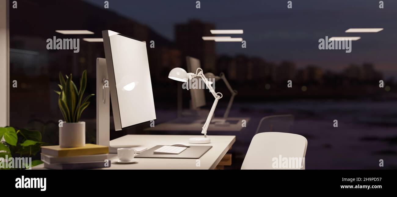 Side view, Modern office working space with computer desk near a large ...