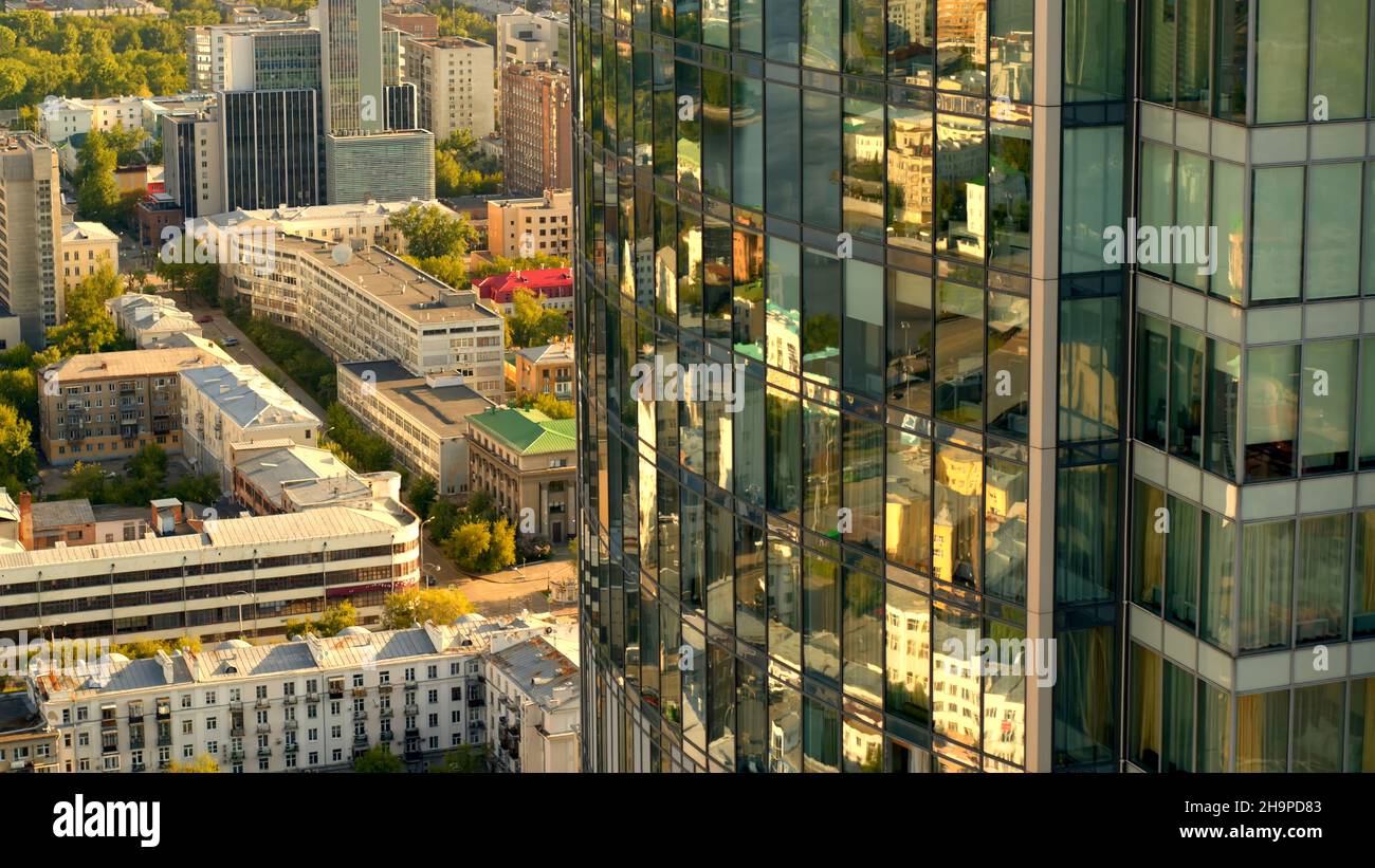 Aerial view of large russian city, buildings, trees and modern glass ...