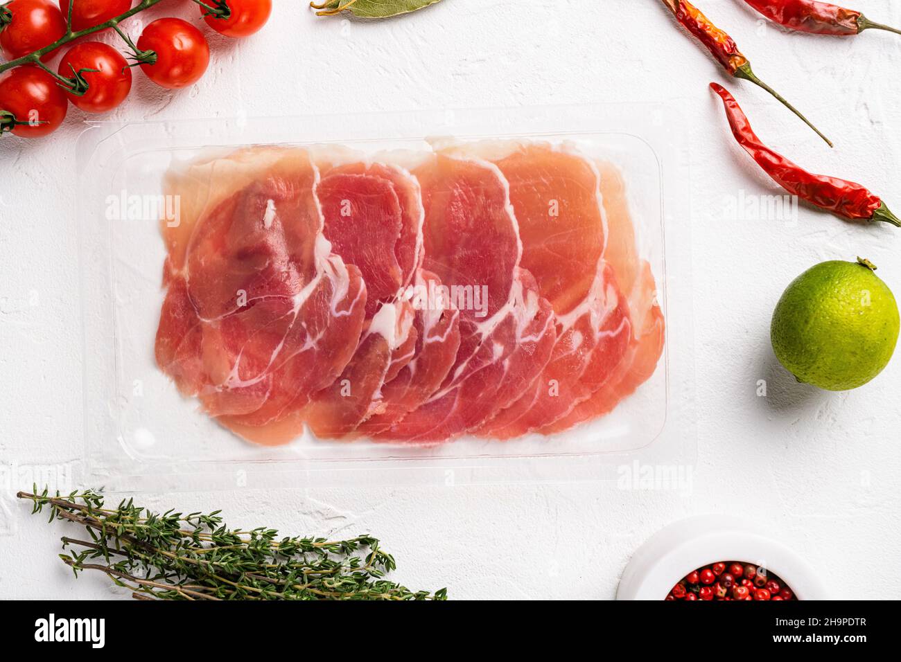 Prosciutto crudo slices package set, on white stone table background ...