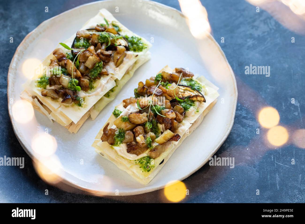 Vegan filo pastry canapes with aubergine and coriander sauce Stock ...