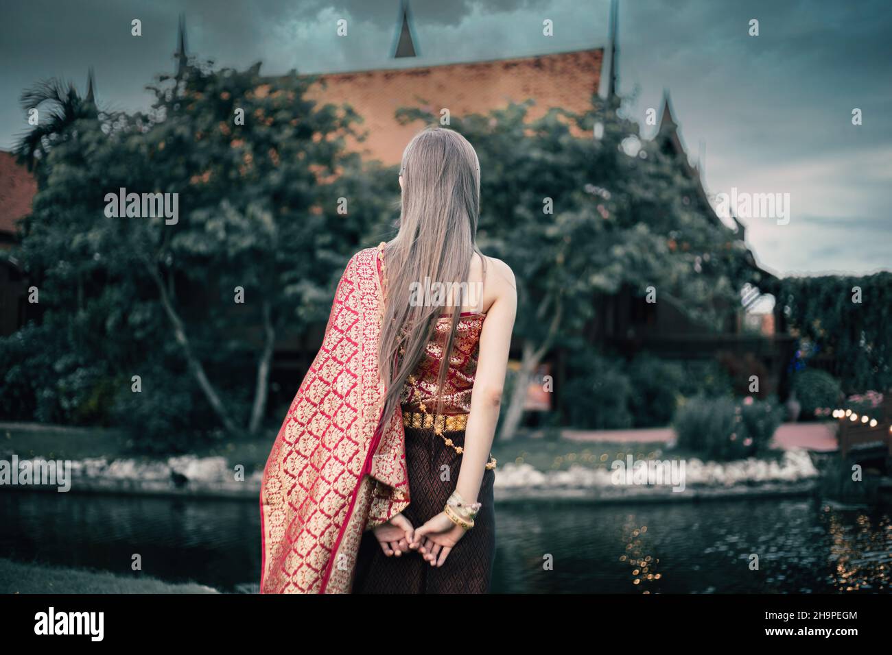 Women wear traditional Thai dress cloth back view standing by river and ...