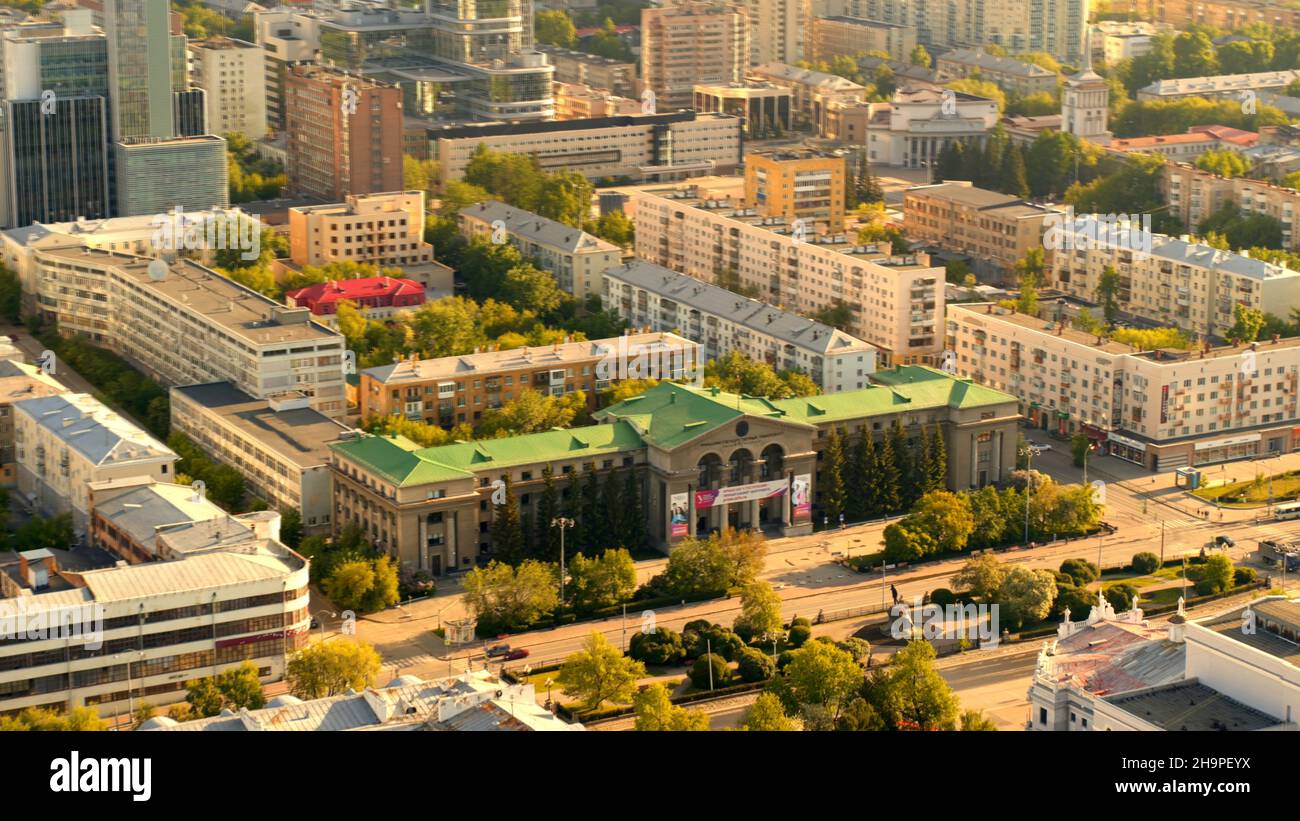 Aerial view of large russian city, buildings, trees and modern glass ...