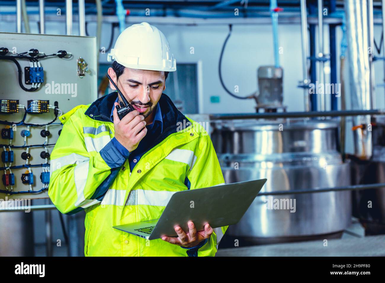 Employee using walkie talkie hi-res stock photography and images - Alamy