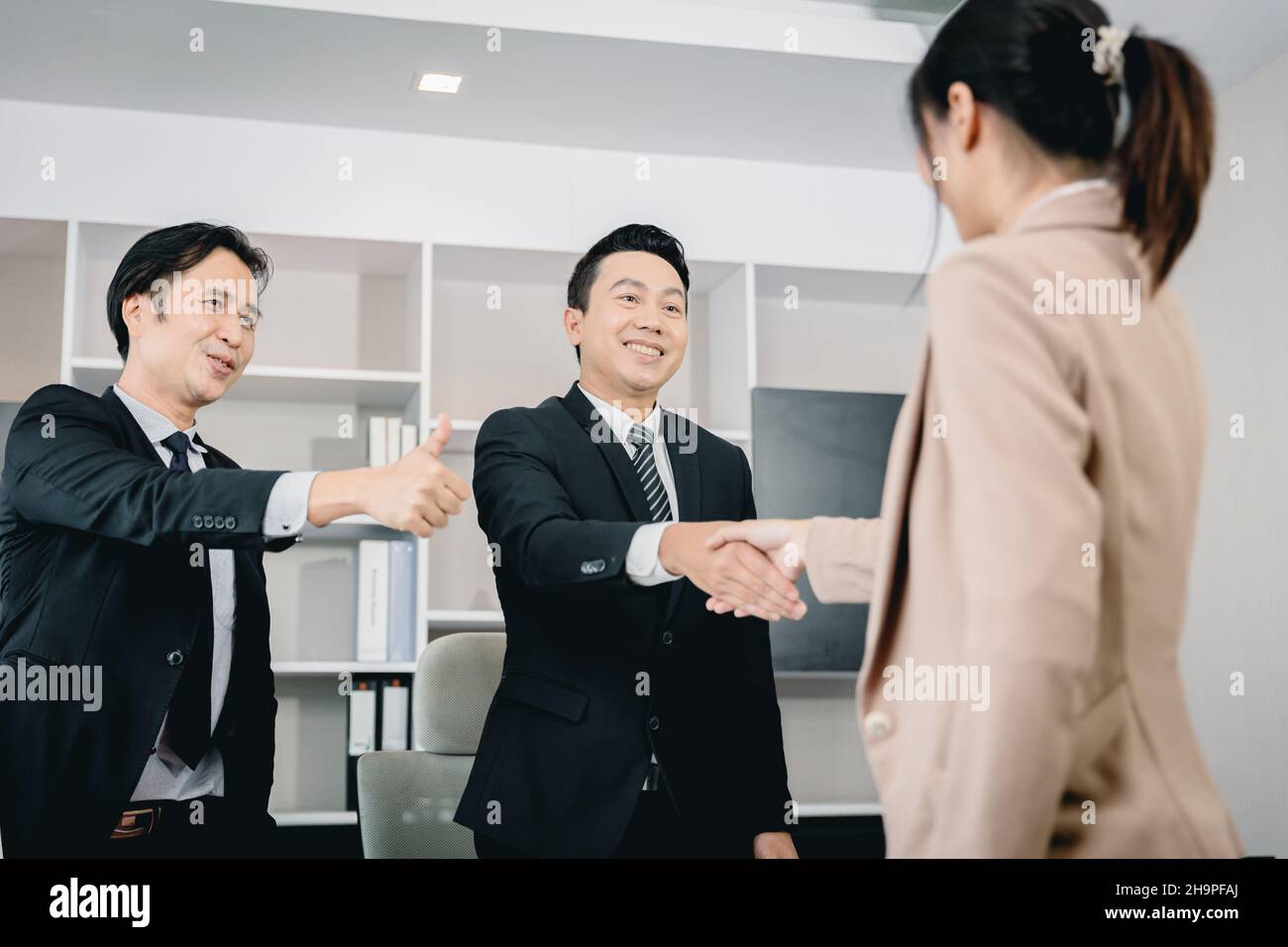Business office staff employee promote congratulate hand shake with ...