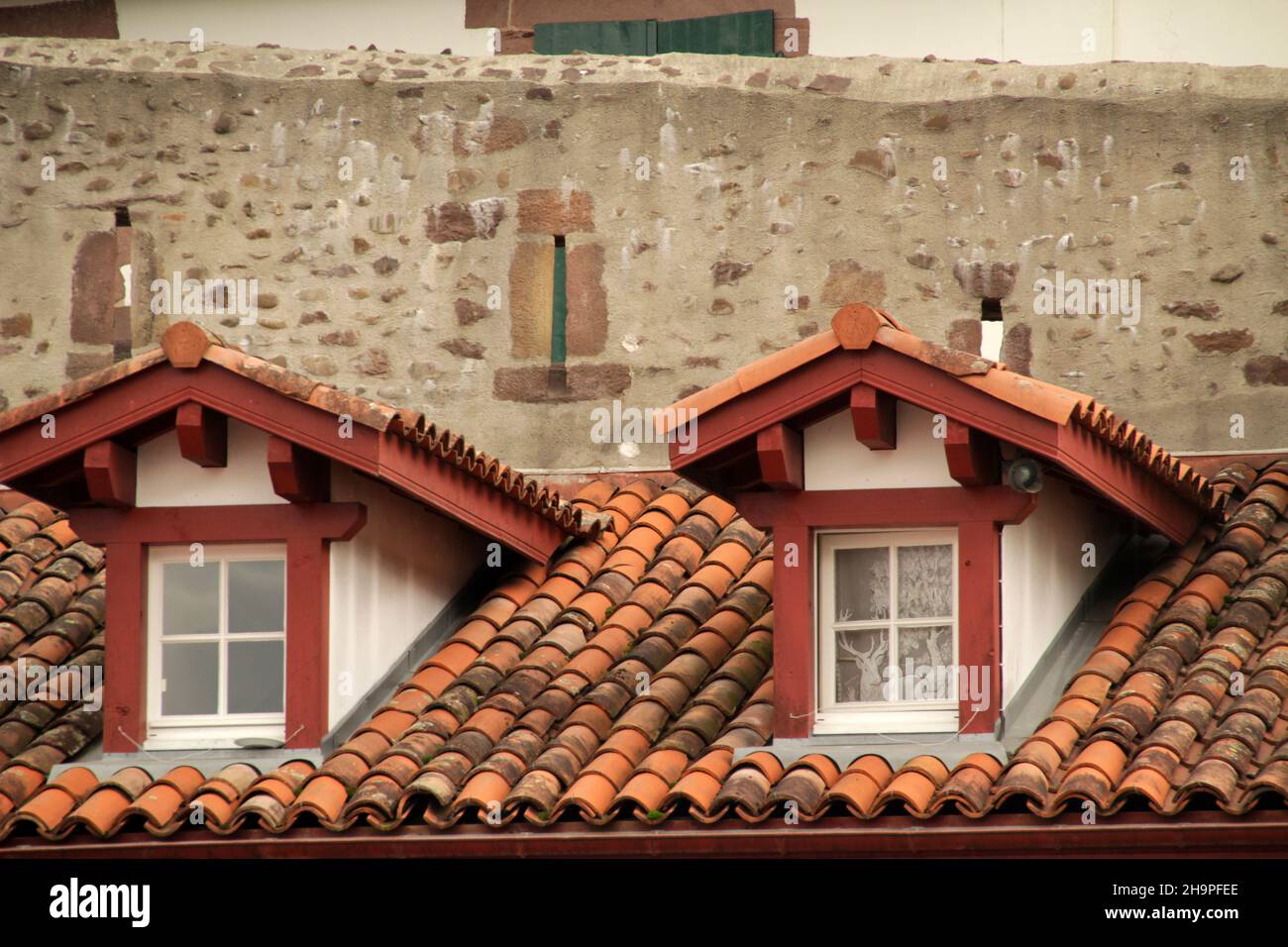 Beautiful shot of a tile roof with two windows in Basque Country ...