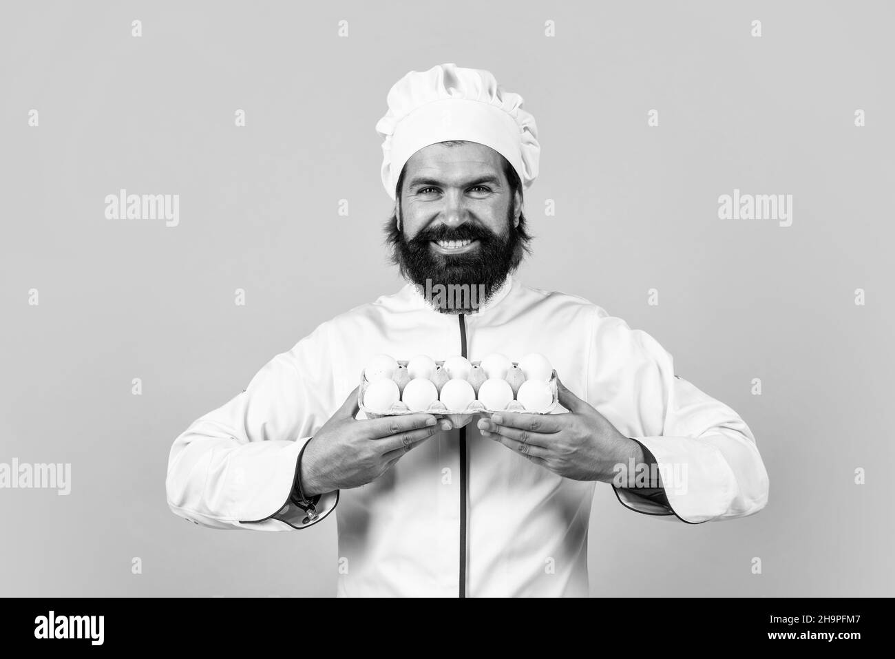 happy guy chef in hat with beard and moustache on yellow background ...
