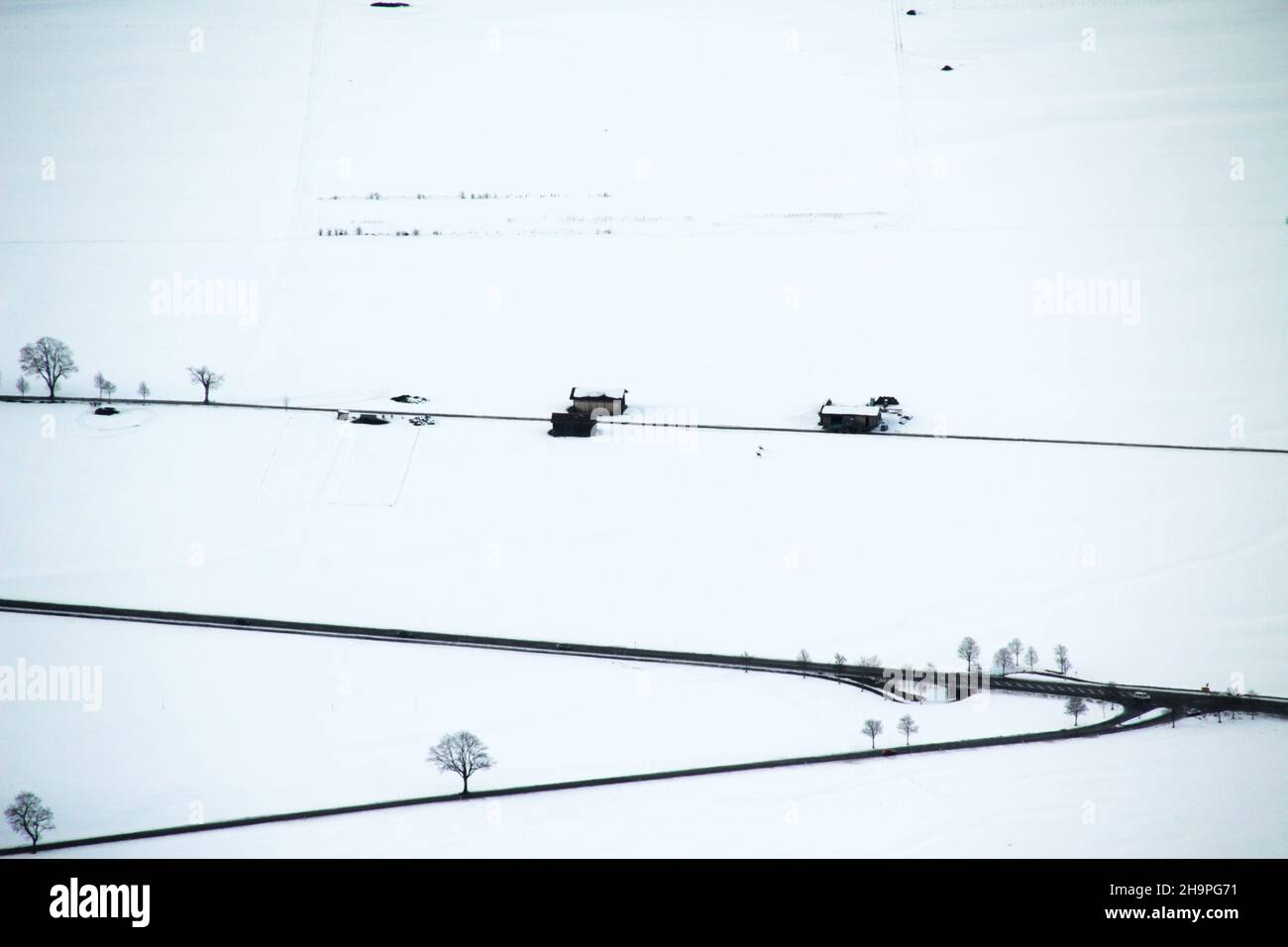 Aerial view of trails through snowy areas on the Alps Stock Photo - Alamy