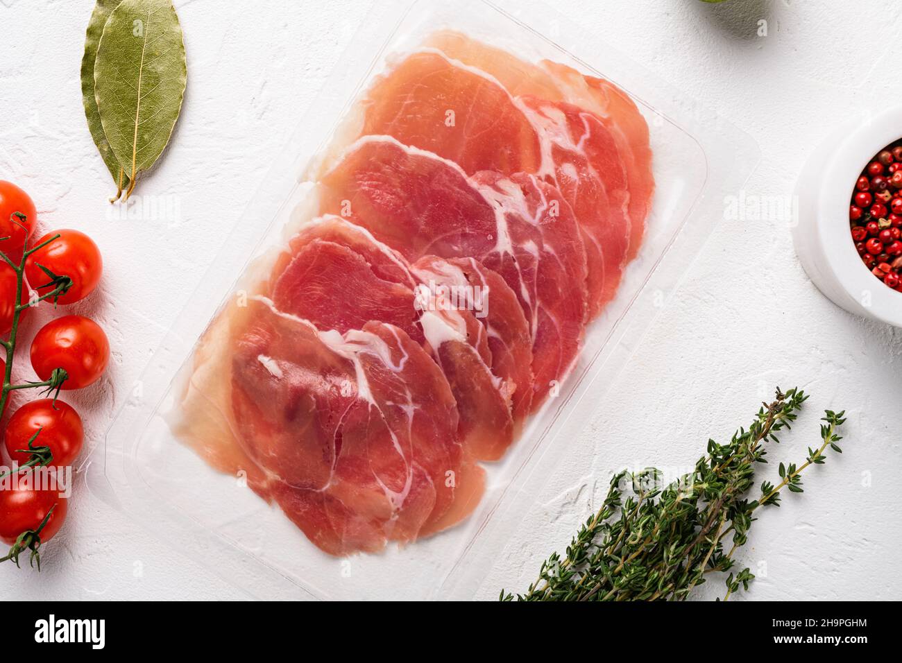 Traditional Spanish cuisine cured pork meat pack set, on white stone ...