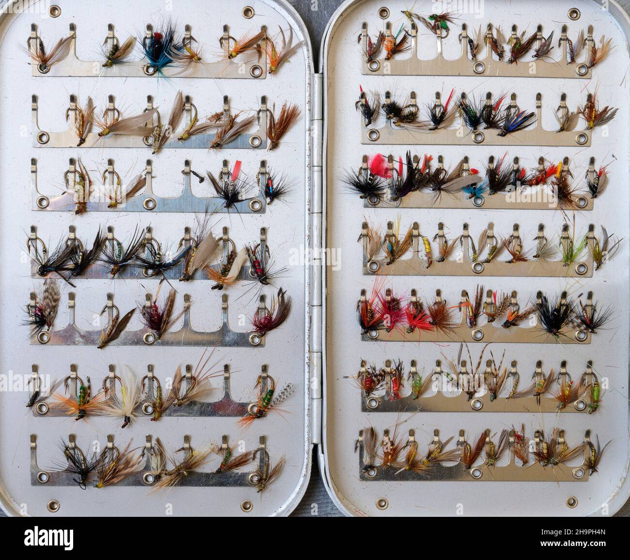 Fly fishing box filled with assorted tied fly lures Stock Photo - Alamy