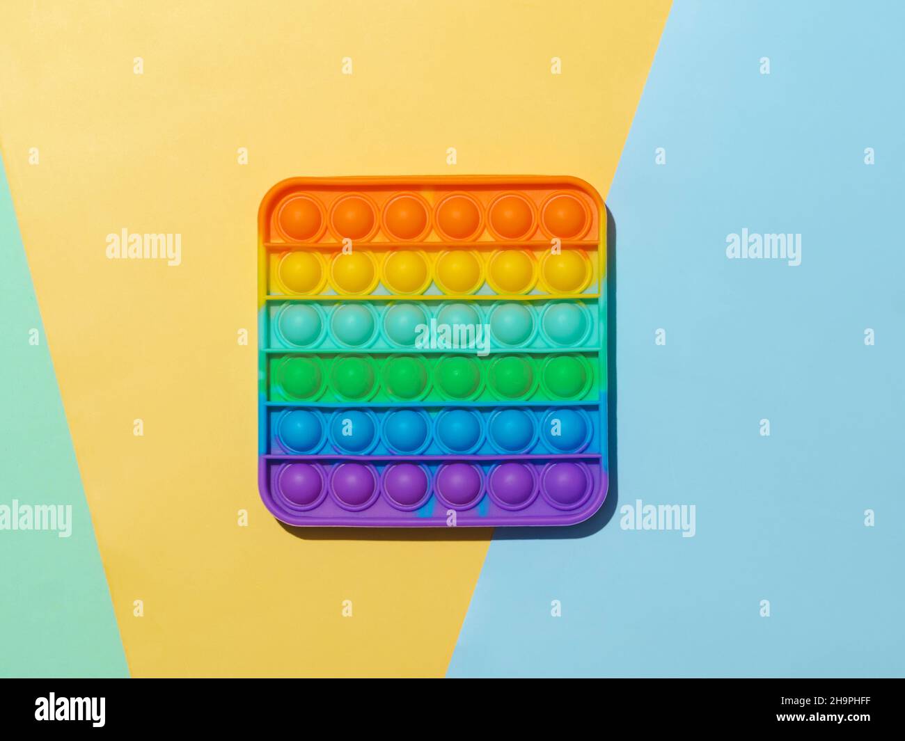 Popit on multicolor background with copy space. Popular silicone ...