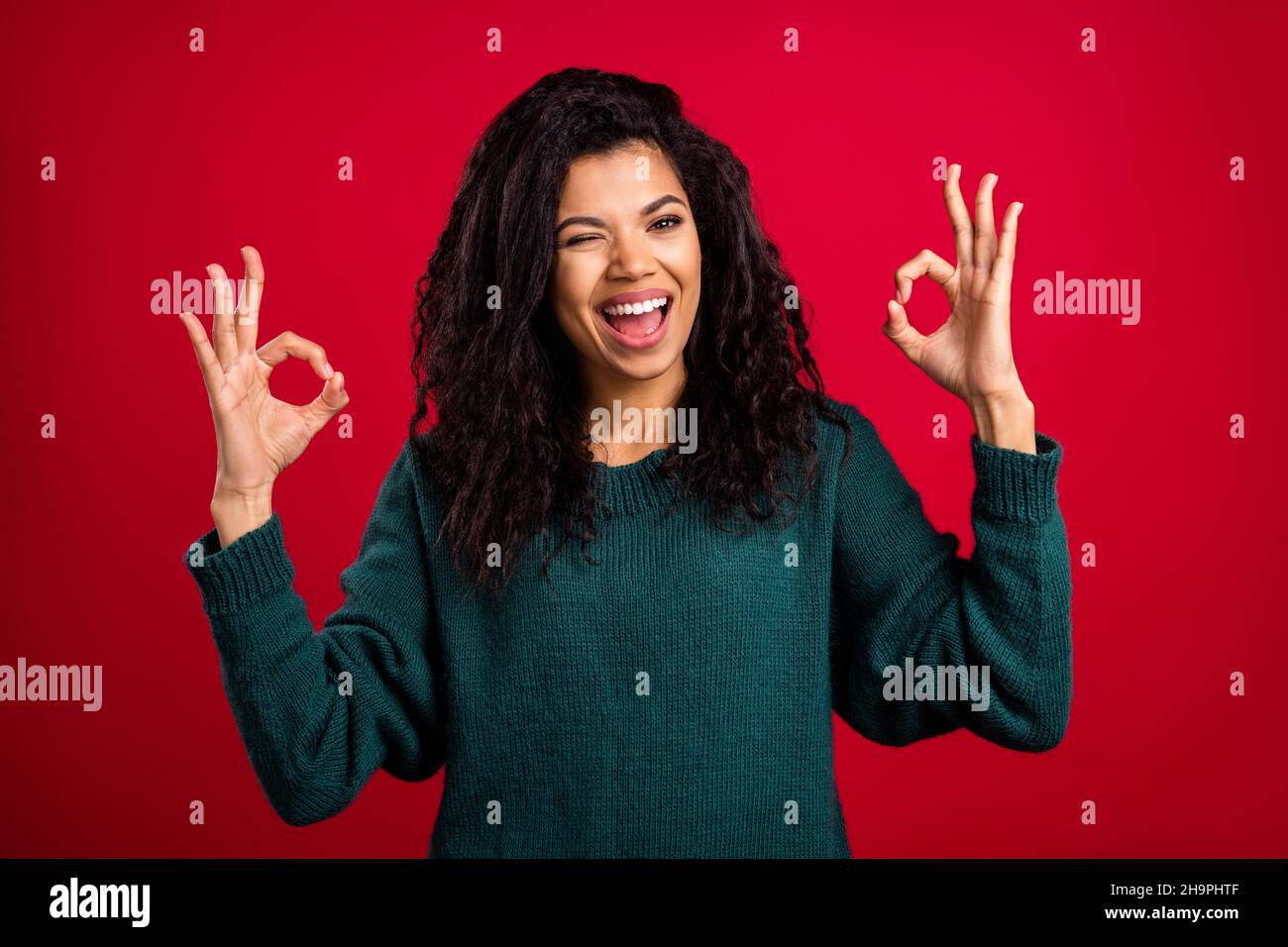 Photo of cheerful nice dark skin young woman make okay signs wink eye ...