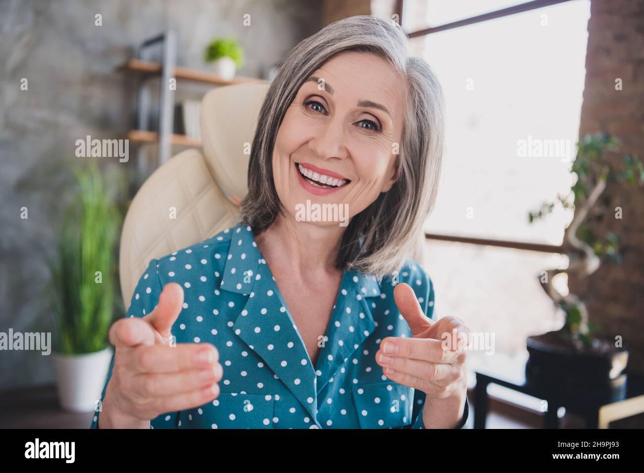 Photo of charming happy old woman point fingers you interview work job ...