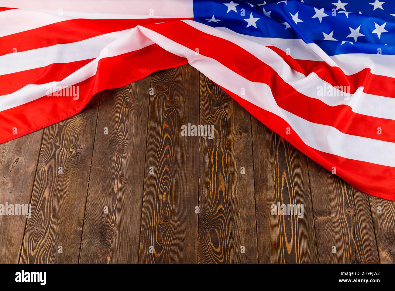 crumpled usa flag on flat textured wooden surface background Stock ...
