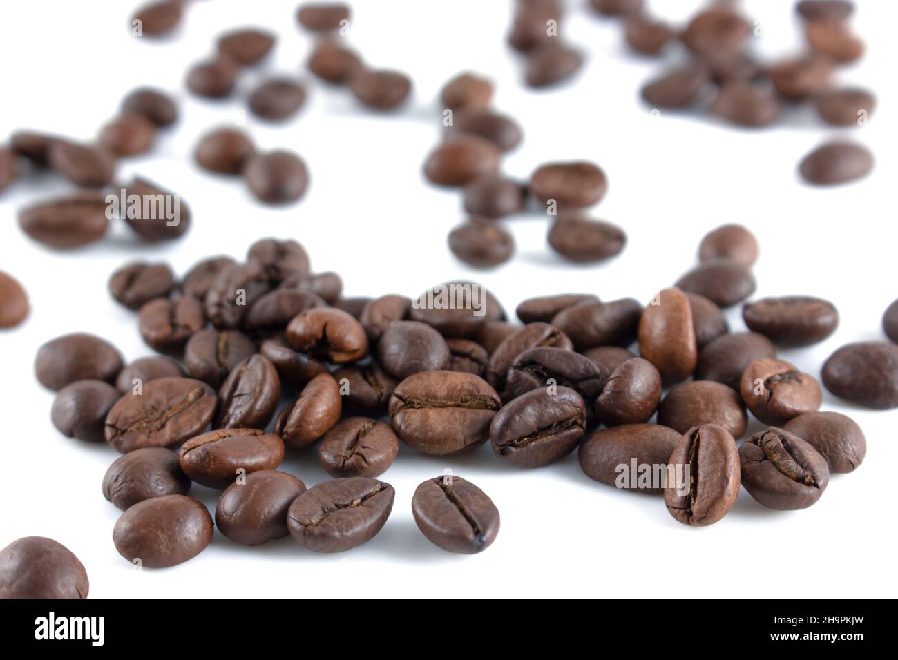 Group of coffee beans isolated on white background Stock Photo - Alamy