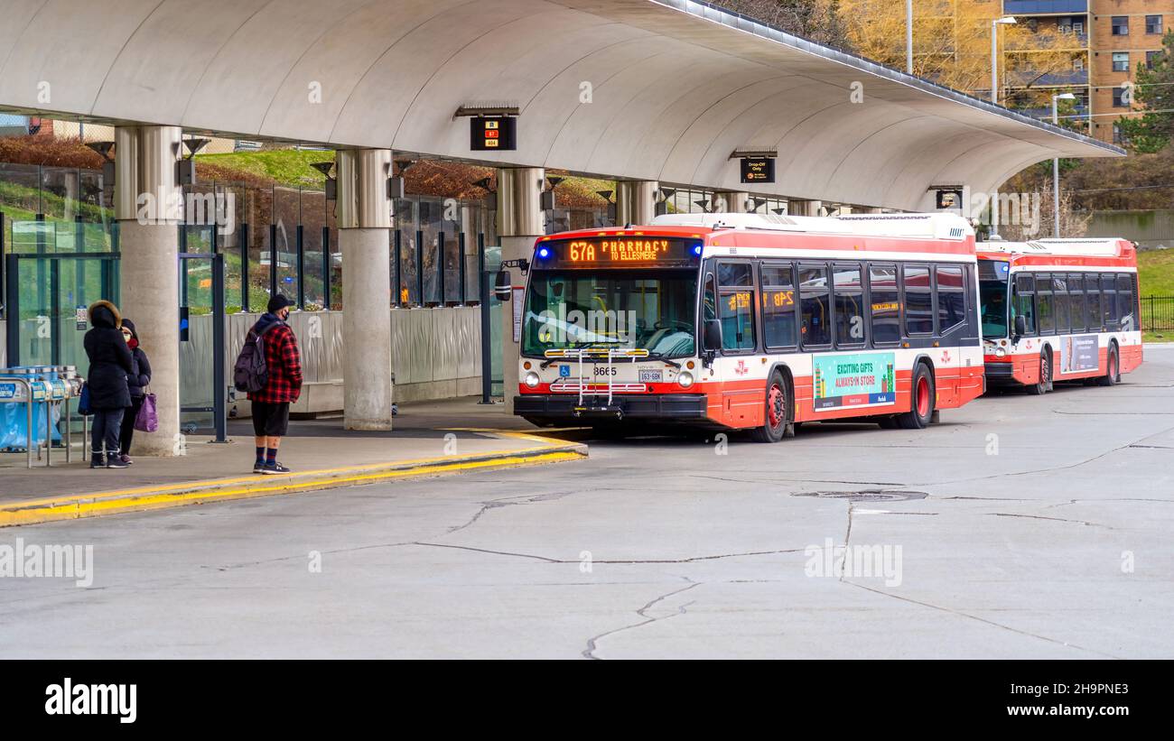 TTC buses and passengers in the platform of the Victoria Park subway ...