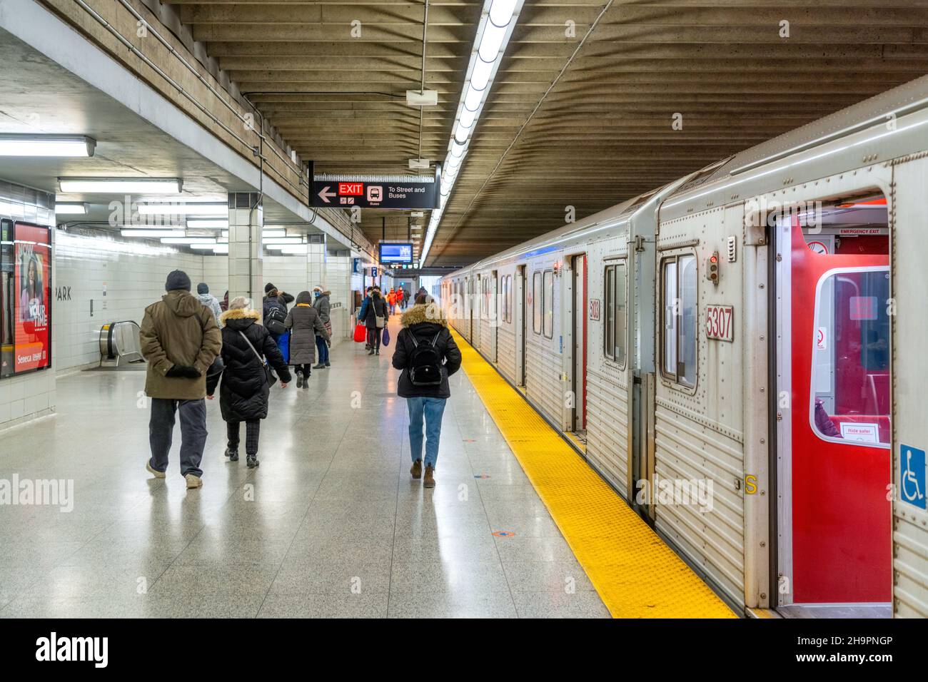 Passengers walking in the platform call Victoria Park subway station ...