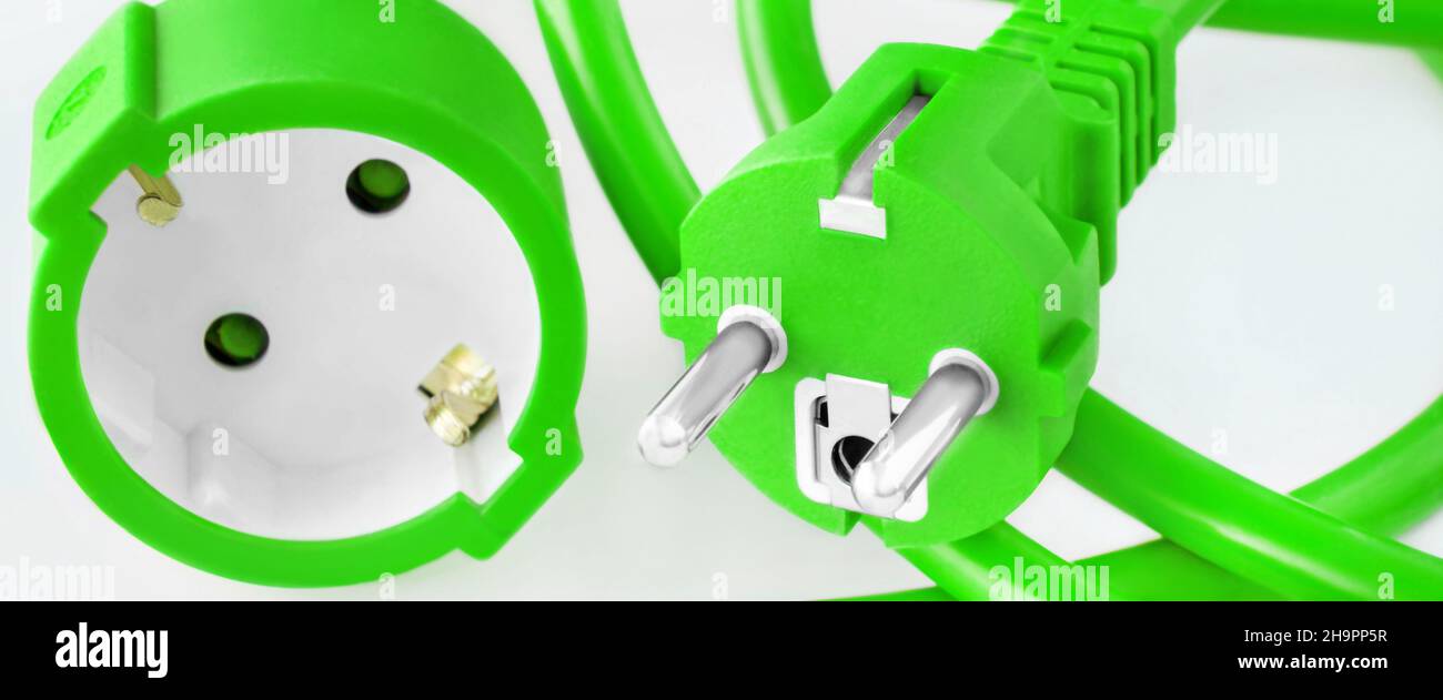 Green energy with cable and plug against white background closeup Stock ...