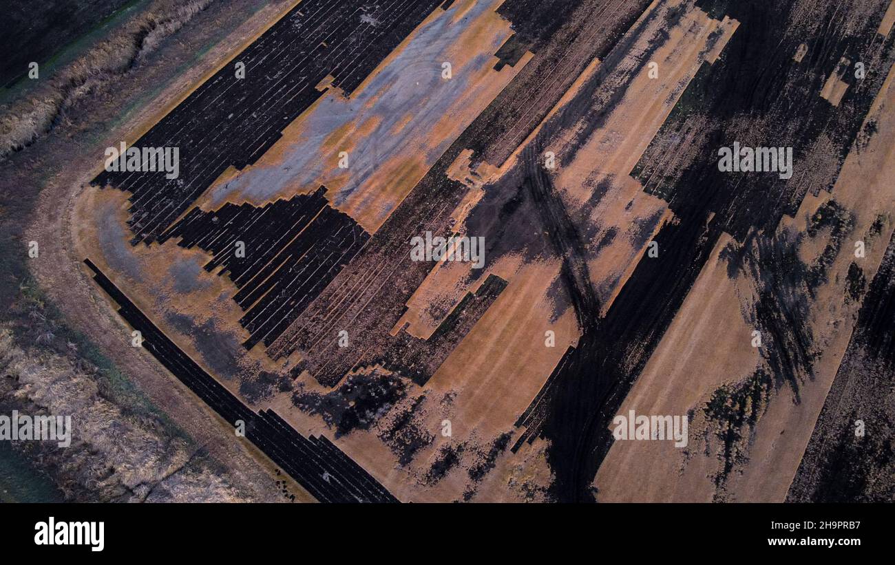 Strange black field from above in rural wisconsin Stock Photo - Alamy