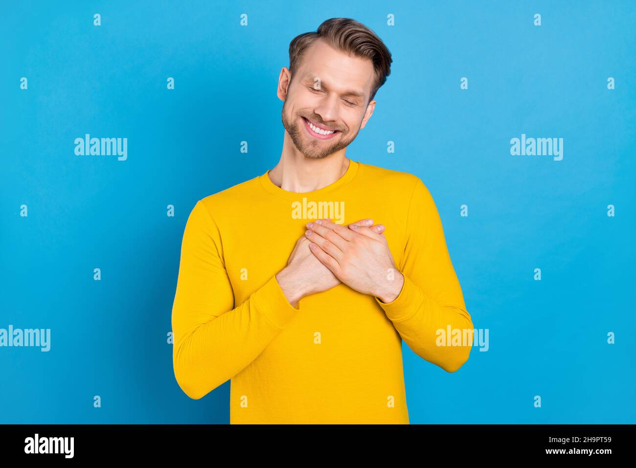 Photo of young guy happy positive smile hands on chest appreciate ...