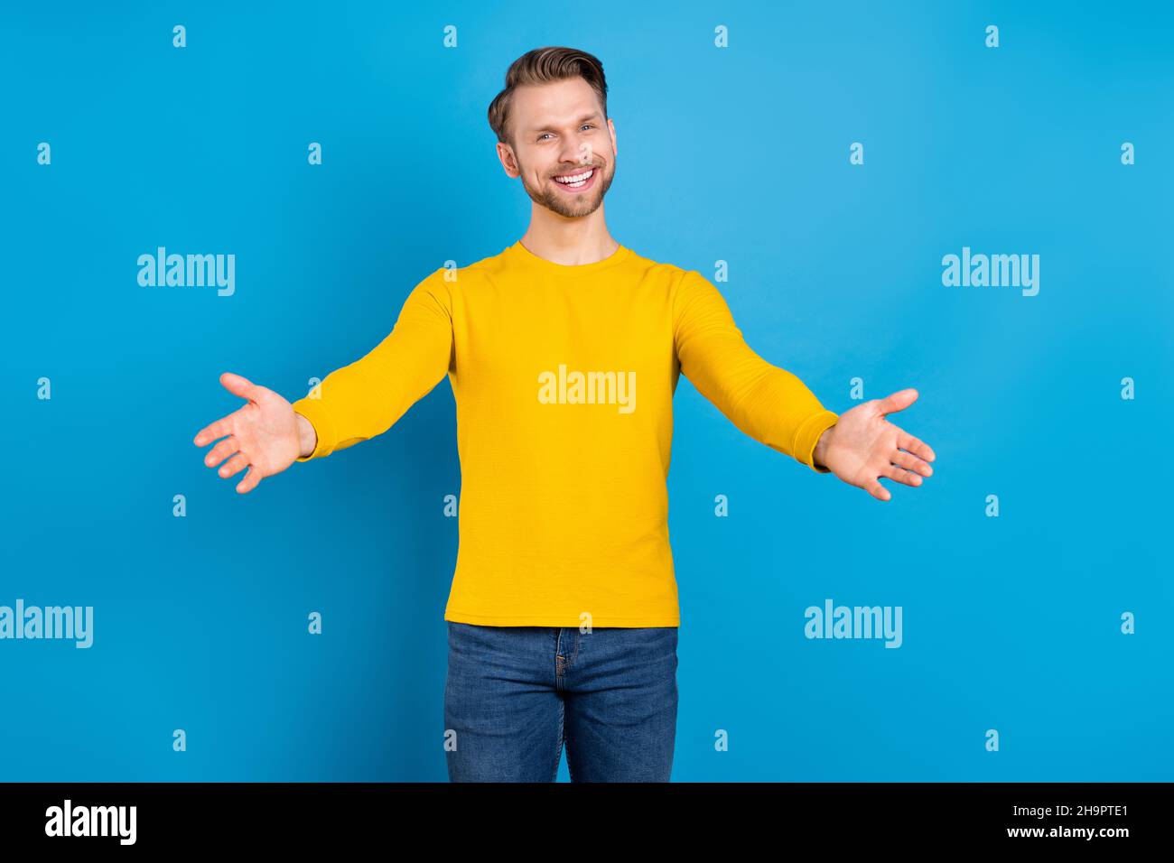 Photo of young guy happy positive smile open arms hug cuddle friendly ...