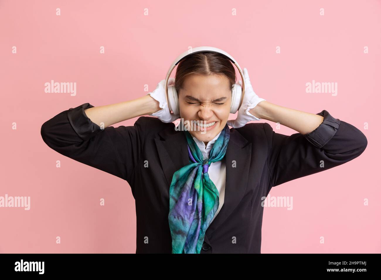 Close-up pretty young shouting female flight attendant, stewardess in ...