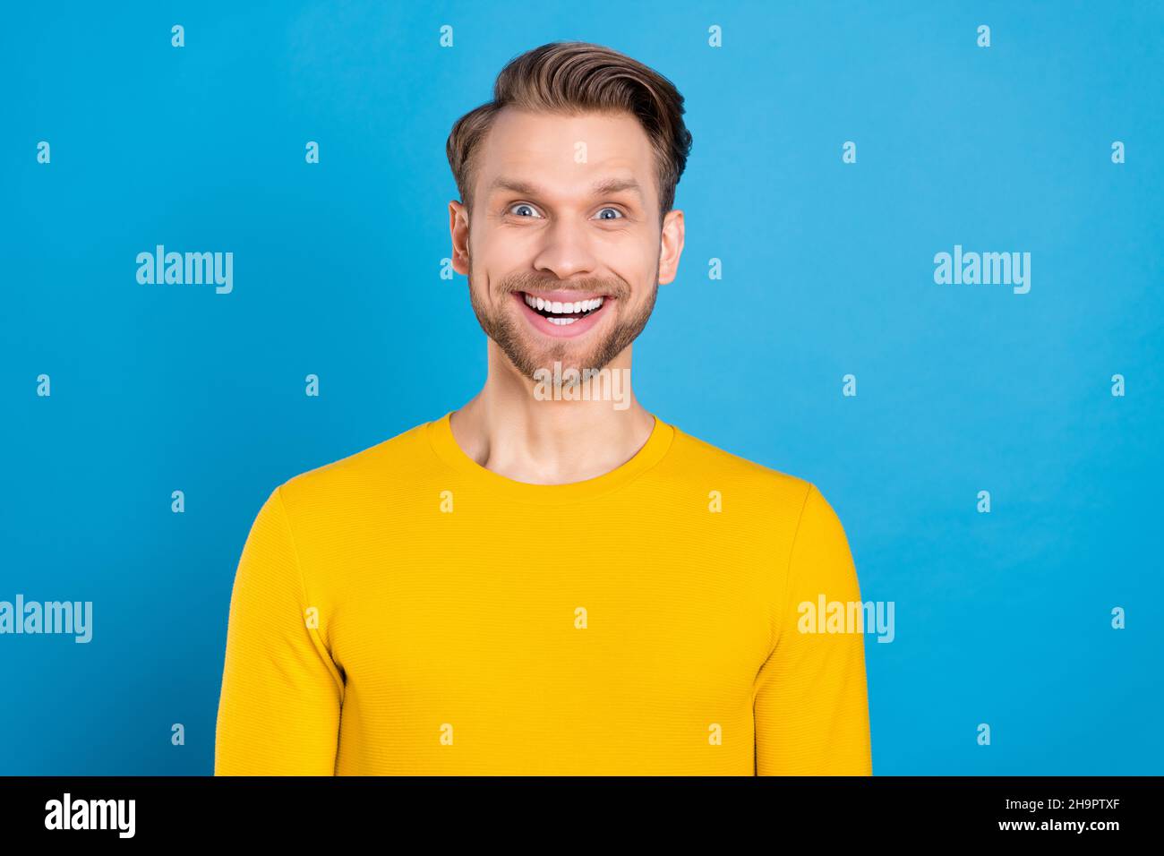 Photo of young excited man happy positive smile amazed surprised news ...