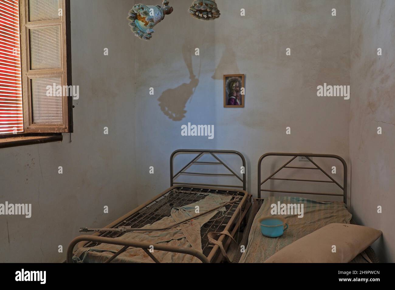 Abandoned bedroom with two beds and open window, lost place, unoccupied ...