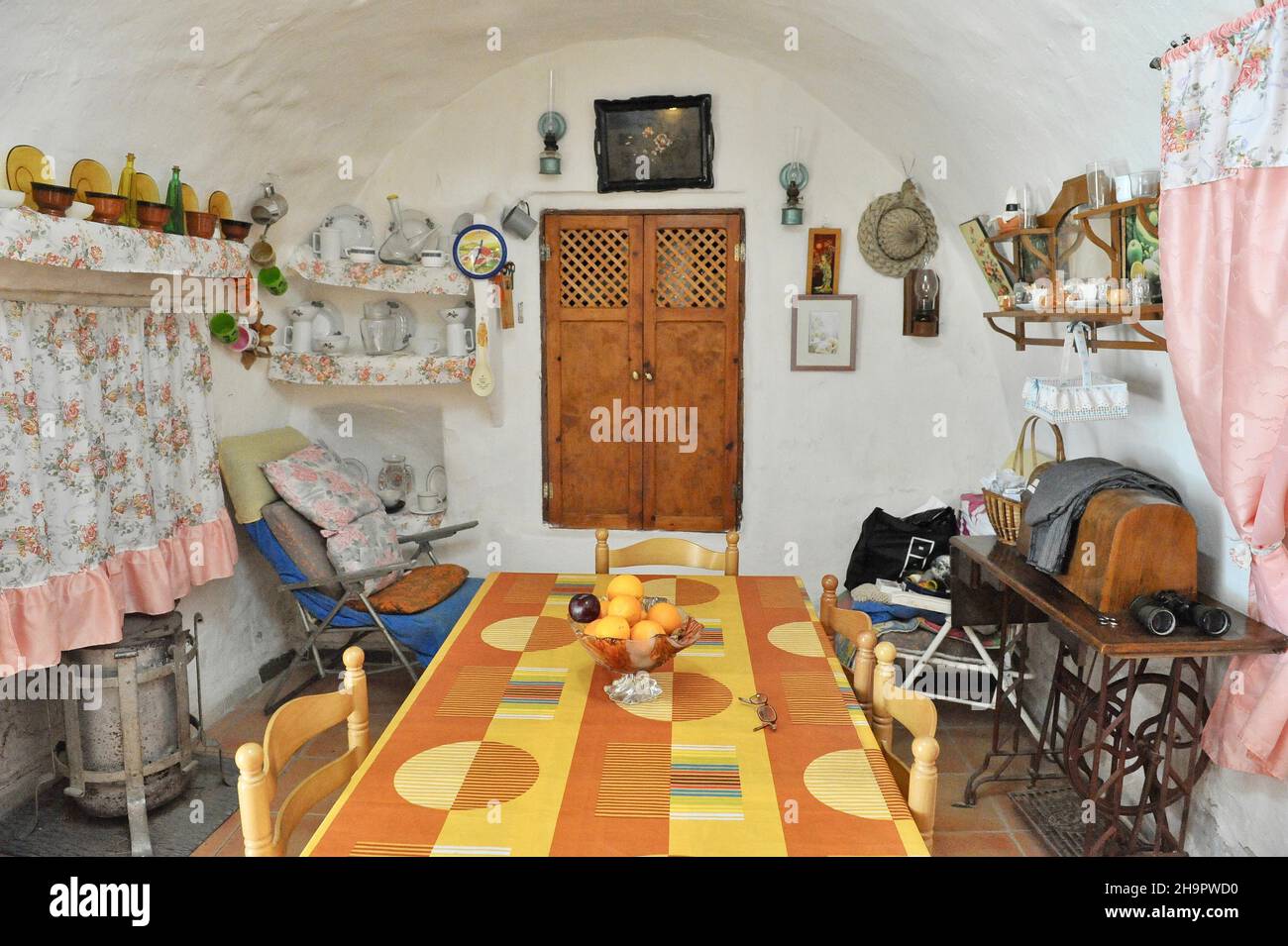 Kitchen with dining table and chairs of a cave dwelling, traditional ...
