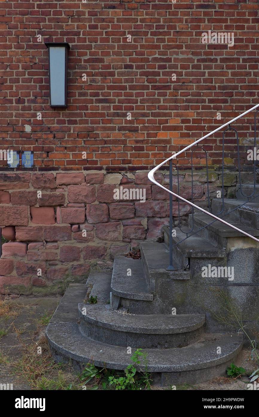 Stairs with railing in front of red brick wall, factory design, old ...