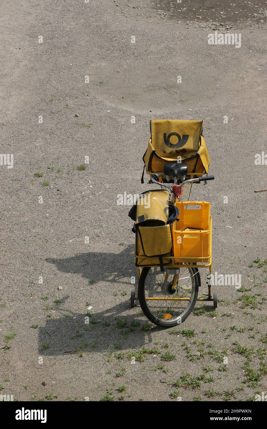 Yellow postal bike with postal bag and front luggage holder, top view, postal bike from above ...