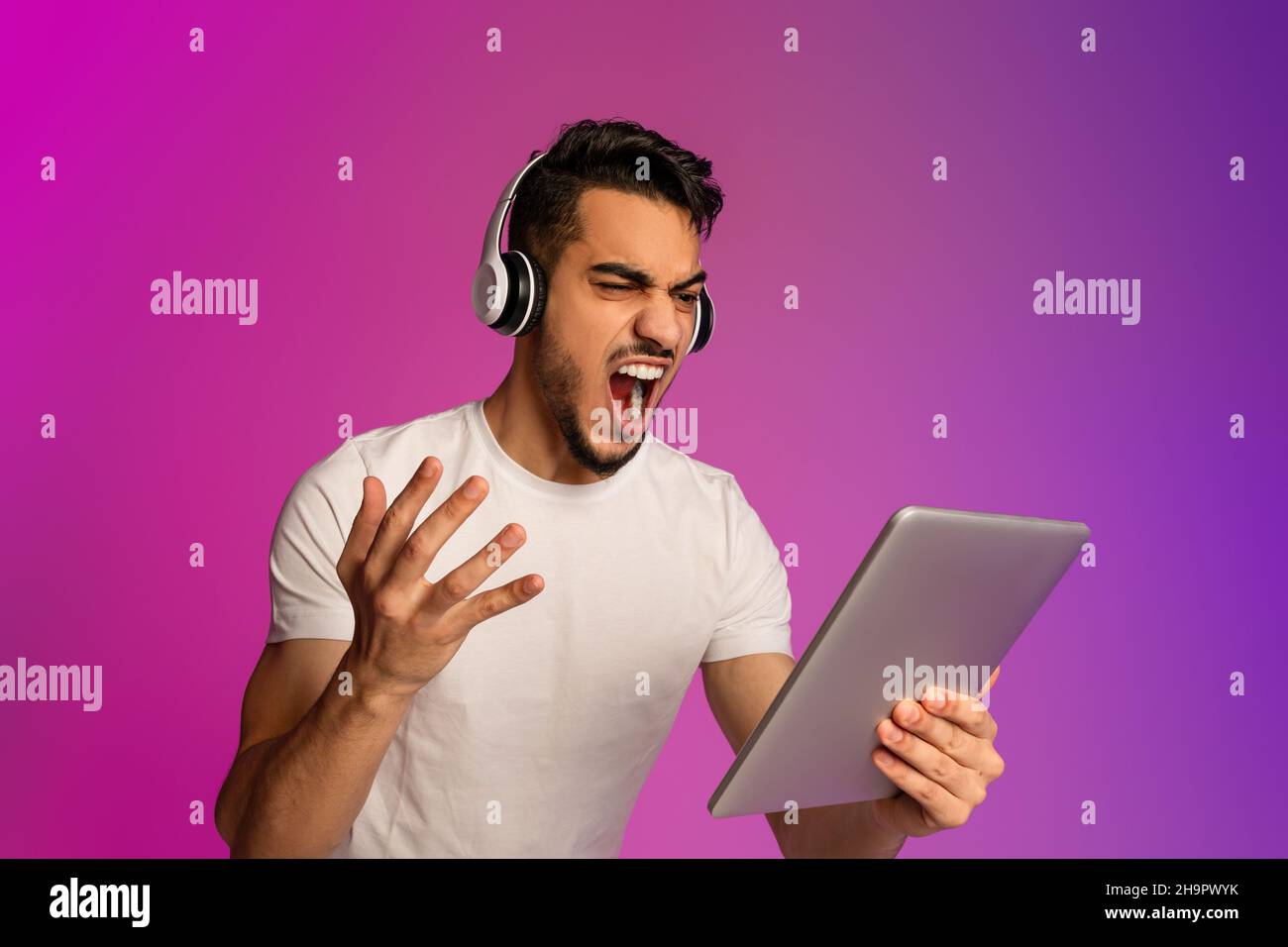 Person watching tv with headphones hi-res stock photography and images ...