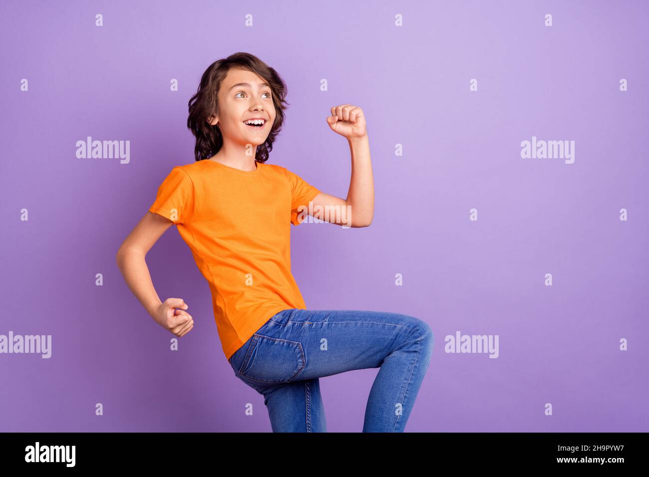Portrait of attractive cheerful glad boy rejoicing dancing having fun ...